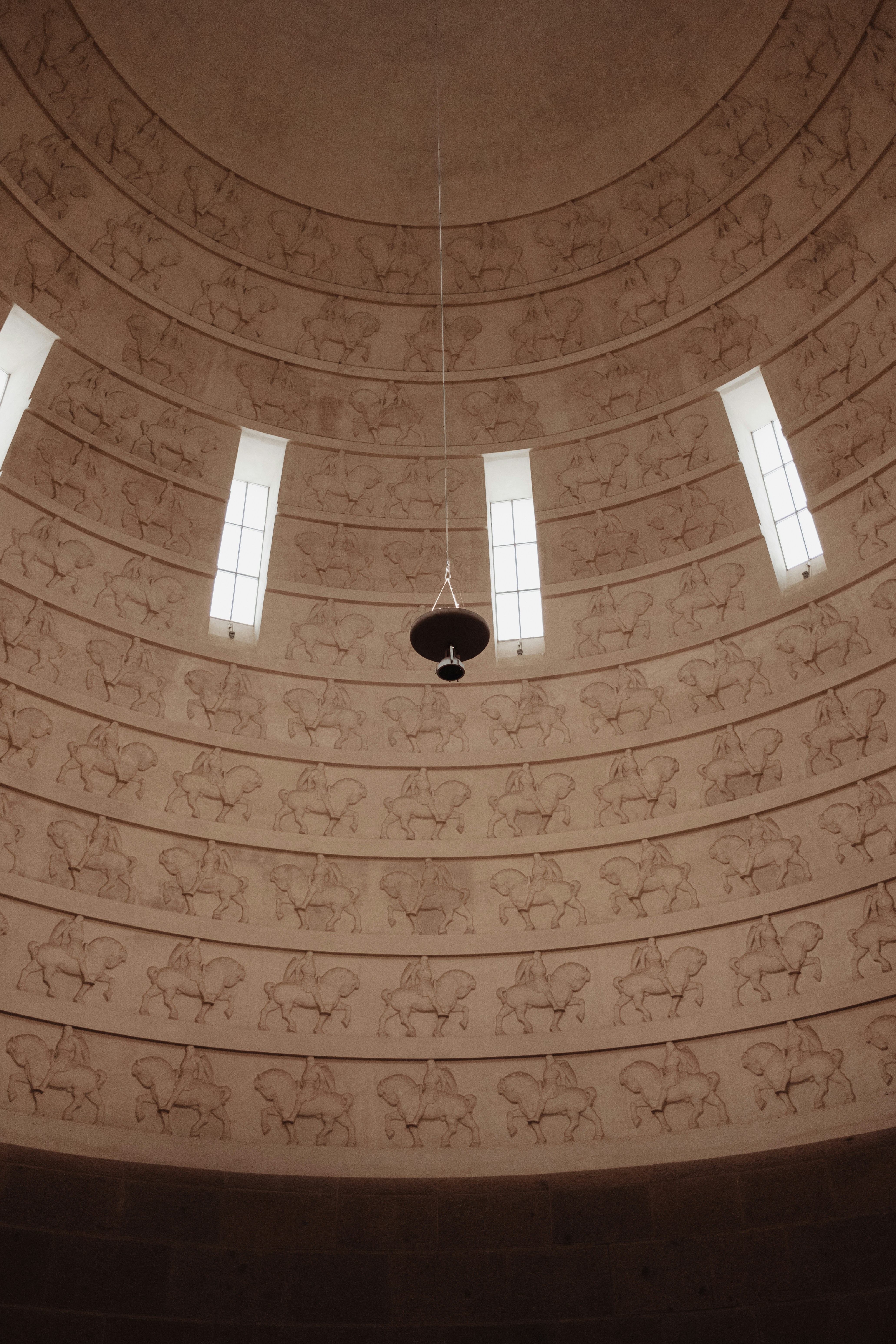 Orbiting Reliefs: A Dome Ringed with Repeating Figures and a Central Lantern