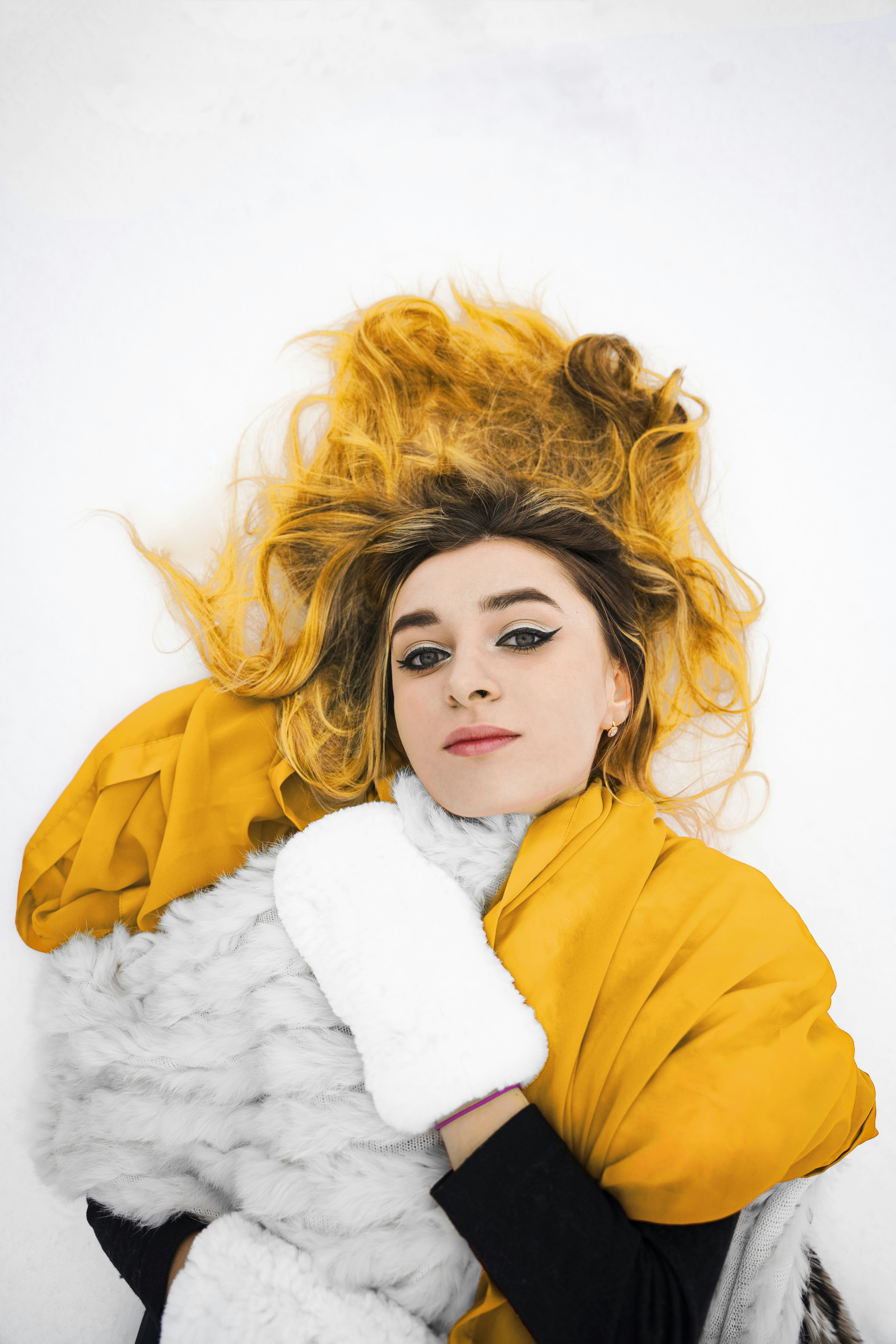 Orange Aura: A Portrait of Poise in Winter White