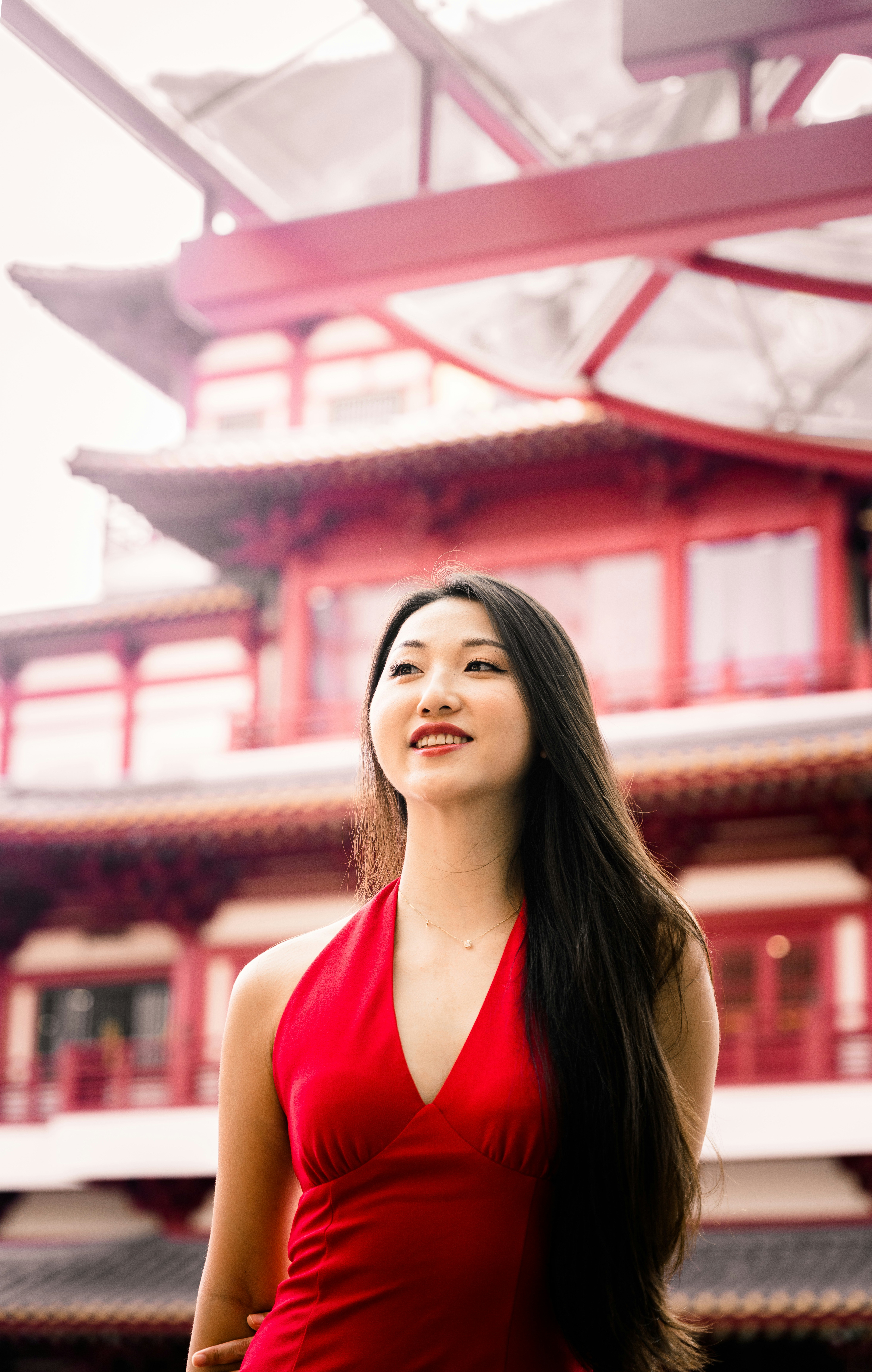 Crimson Grace Before a Red Pagoda Backdrop