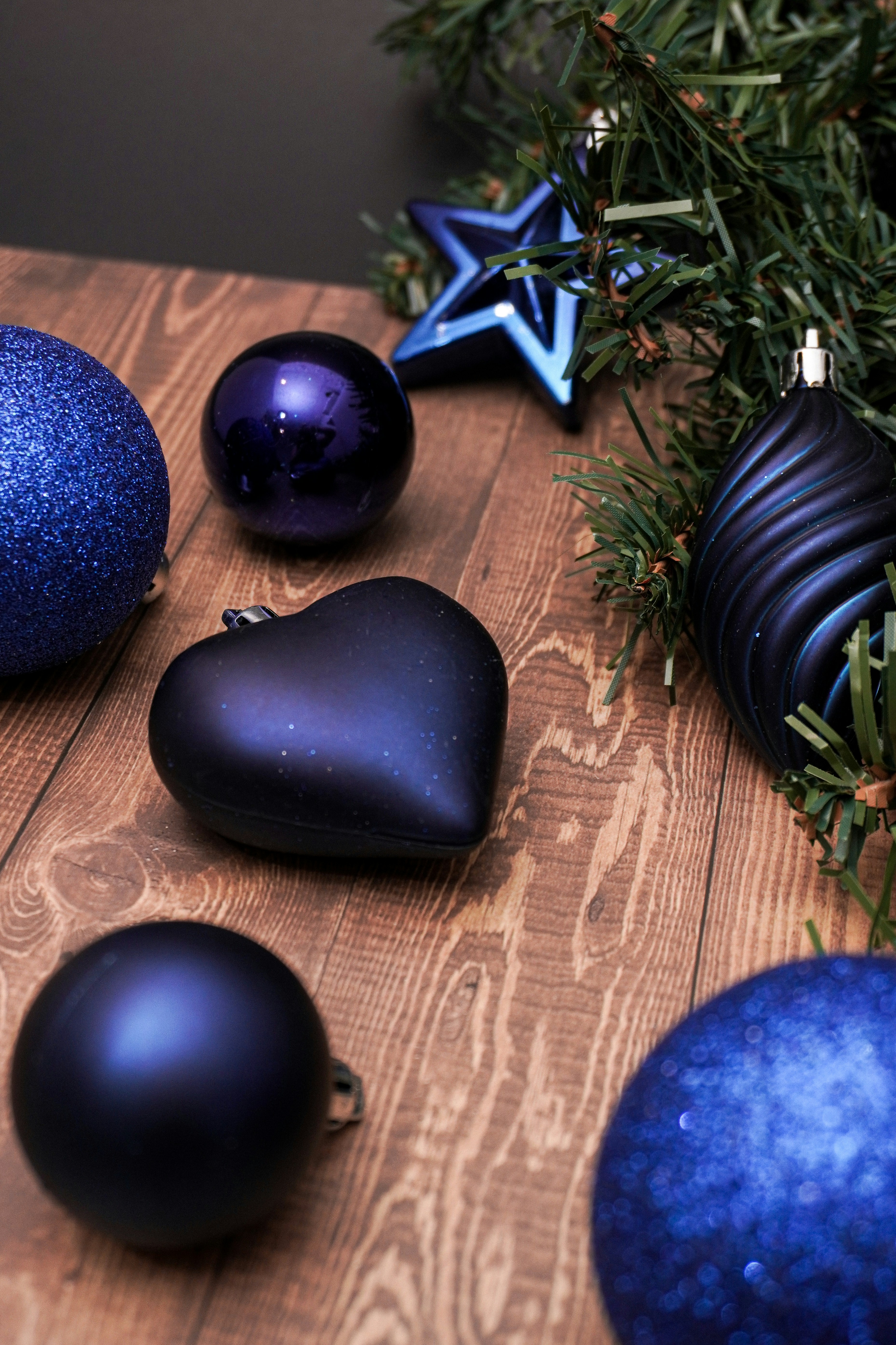 A group of black objects on a wooden surface photo – Free Christmas ...
