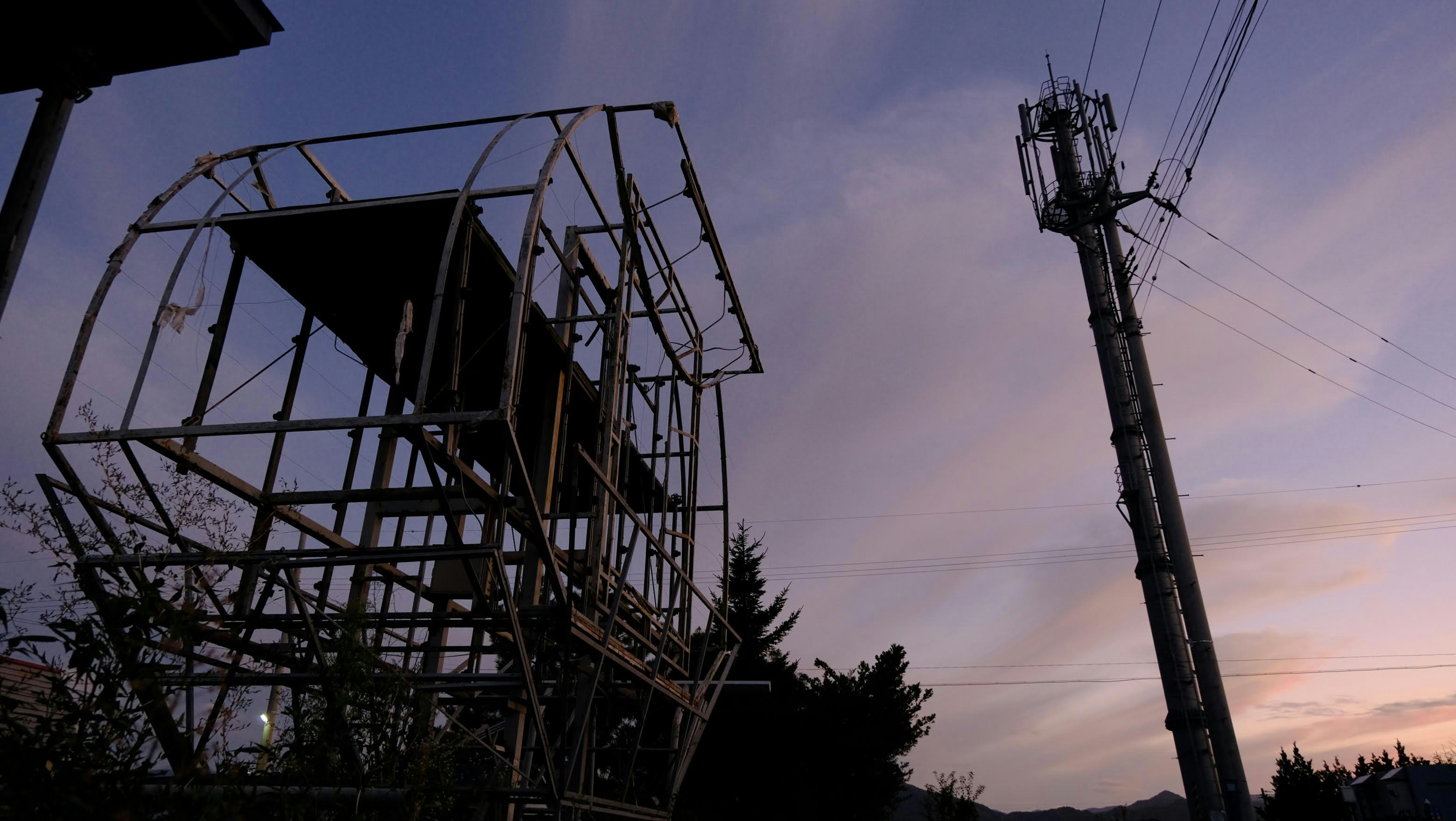 Dusk Scaffold Against a Quiet Sunset