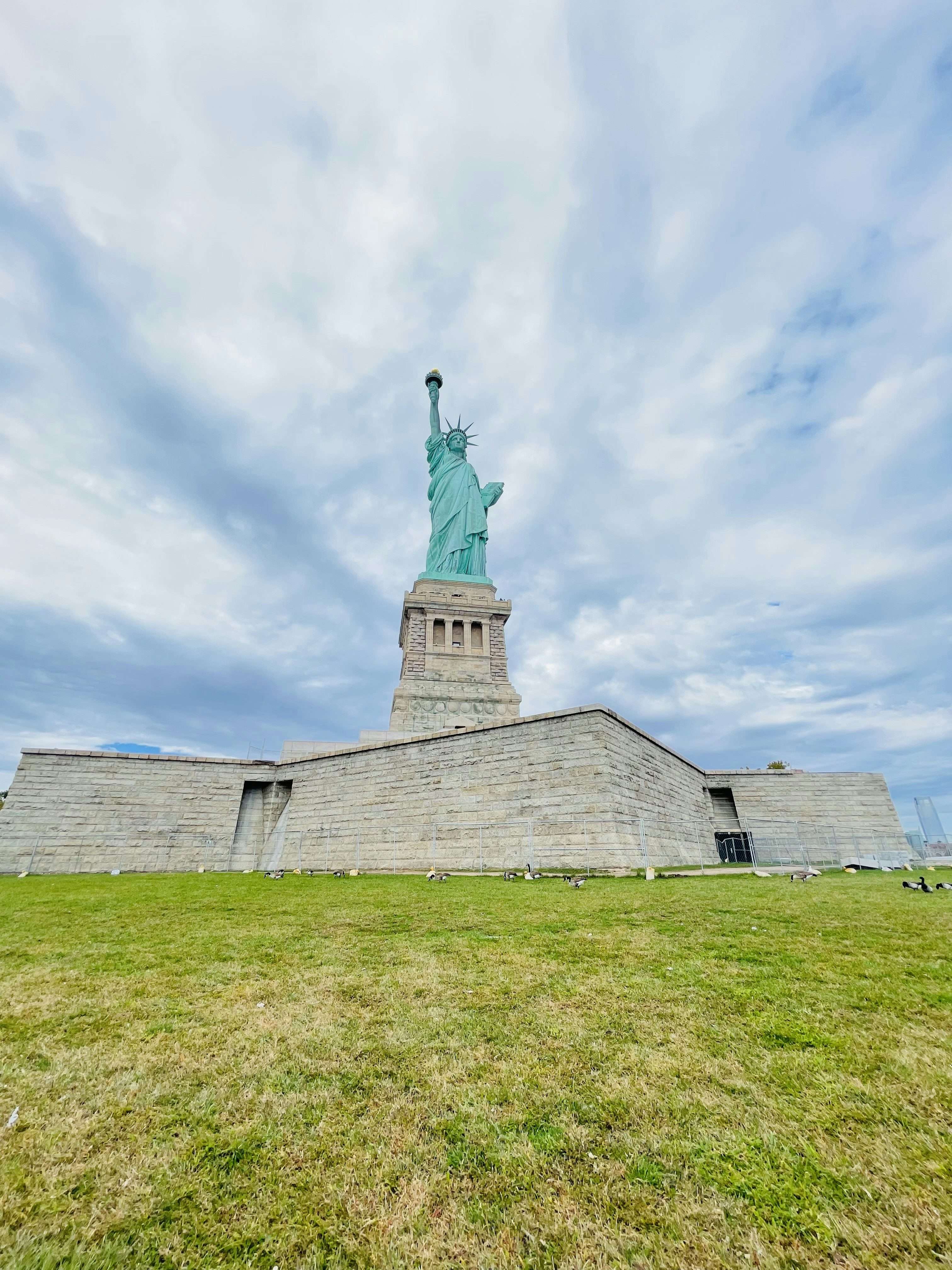 Emerald Torch: The Statue of Liberty Against an Open Sky