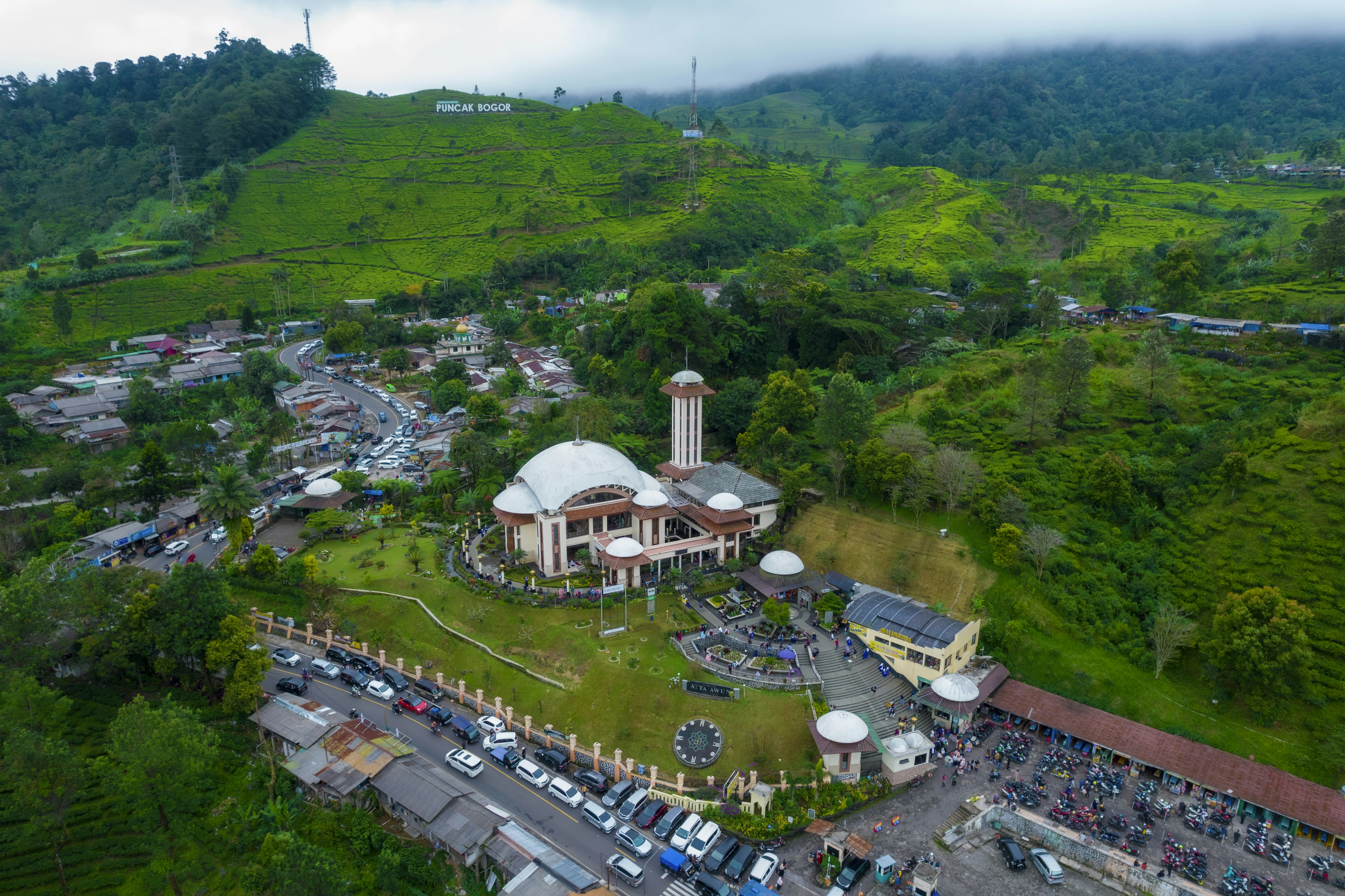 Dome Sanctuary Overlooking a Terraced Hillside Village