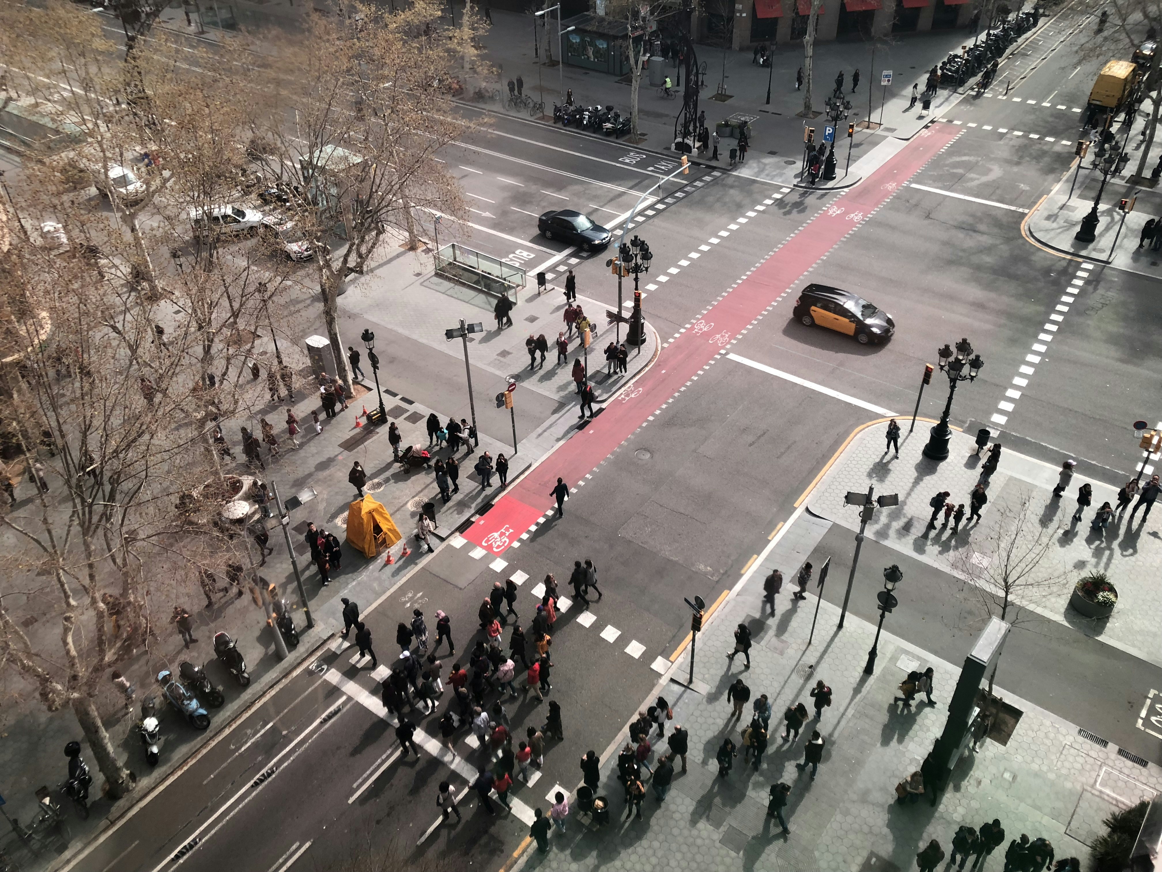 A high angle view of people crossing a street photo – Free People Image ...