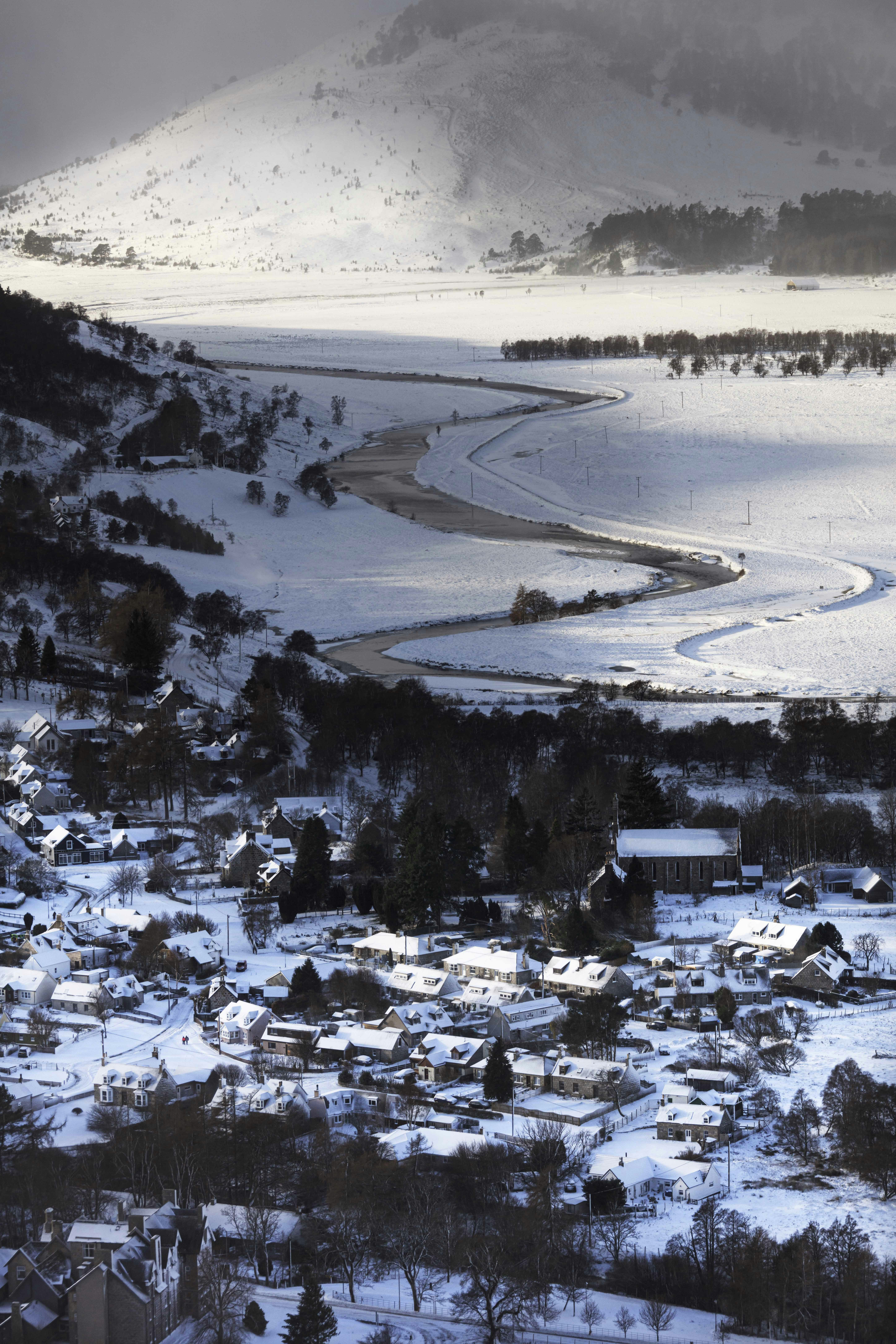A snowy landscape with buildings and trees photo – Free Land Image on ...
