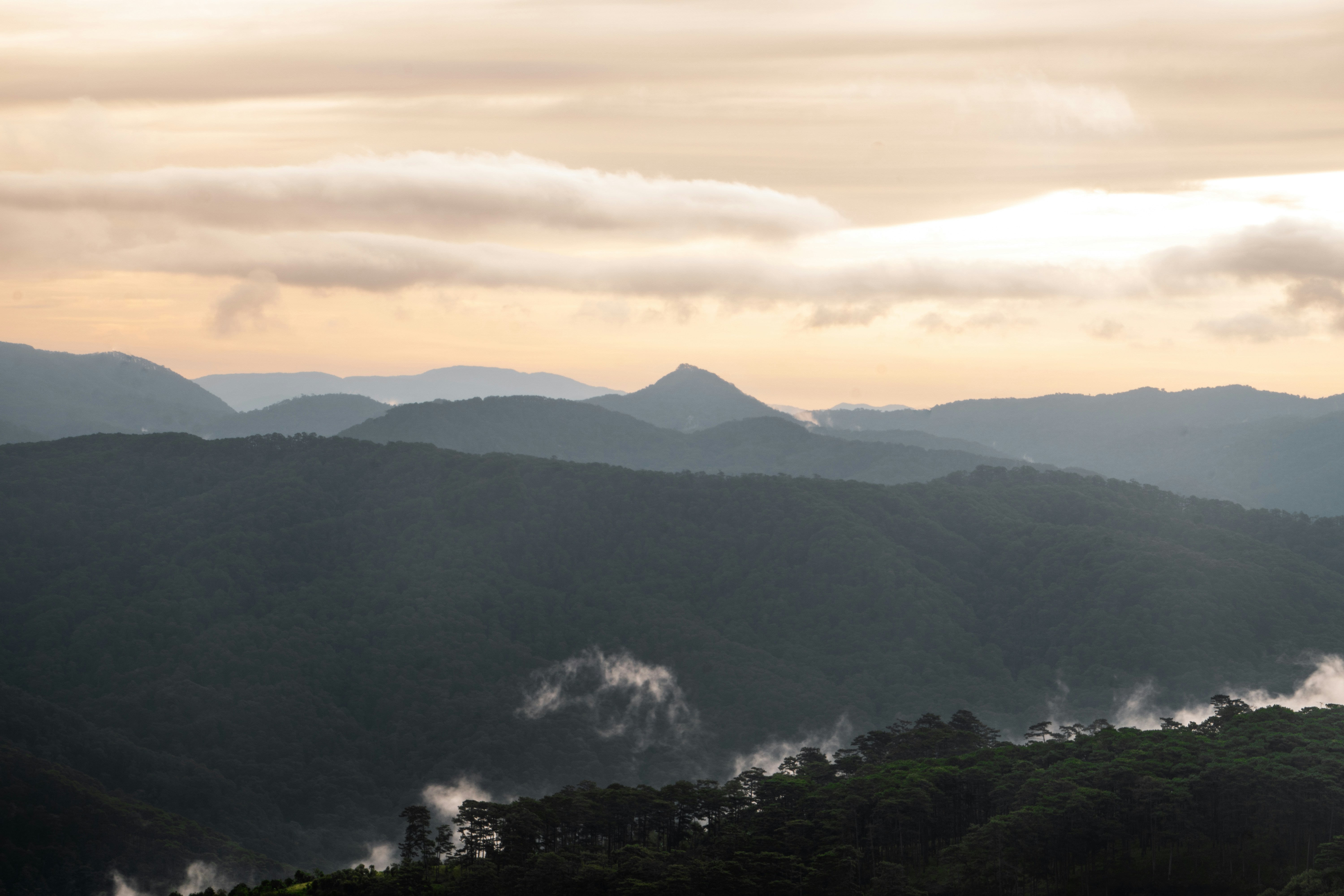 Dawn Veil Over Layered Valleys