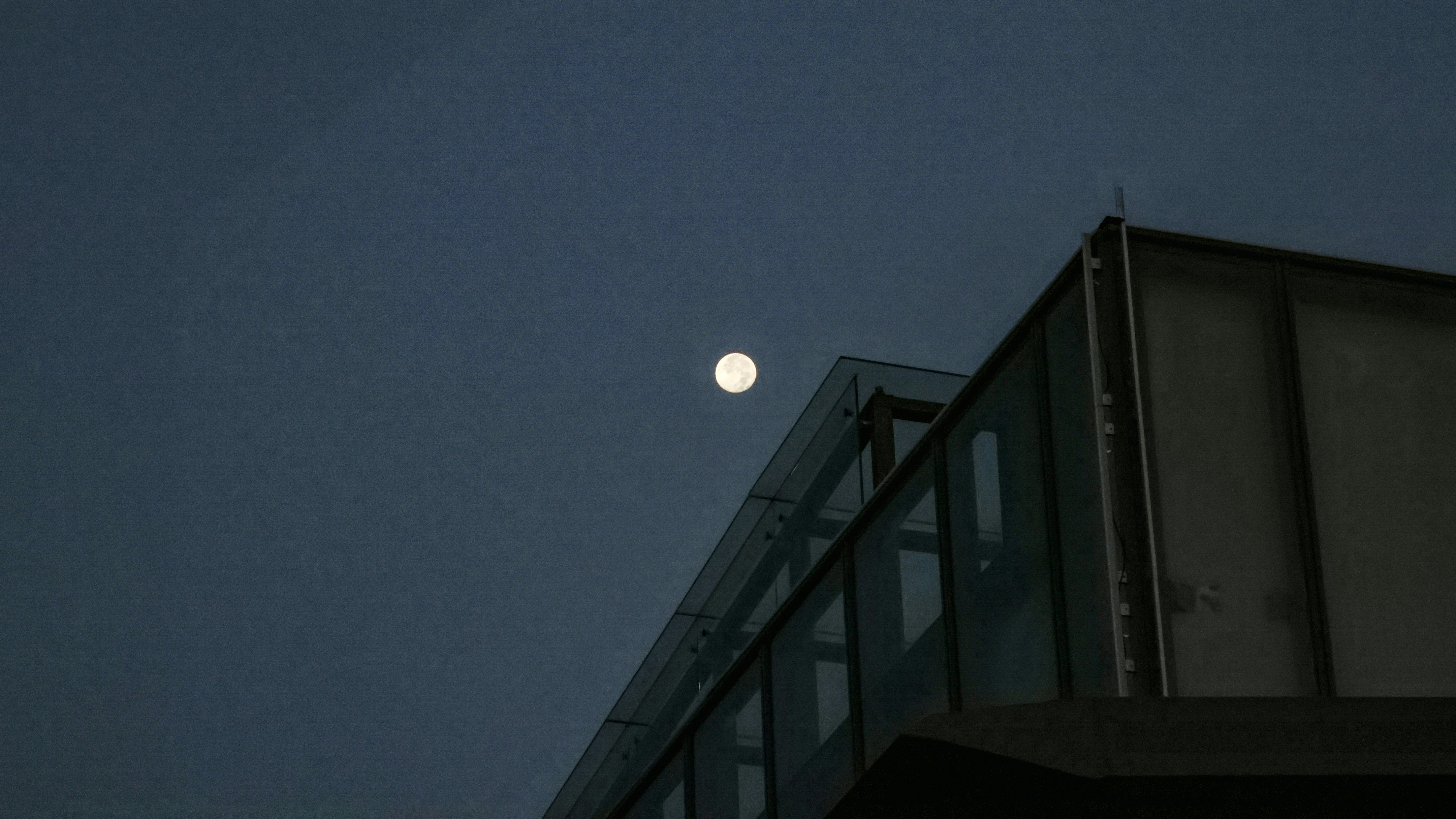 A building with a full moon in the sky photo – Free Outdoors Image on ...