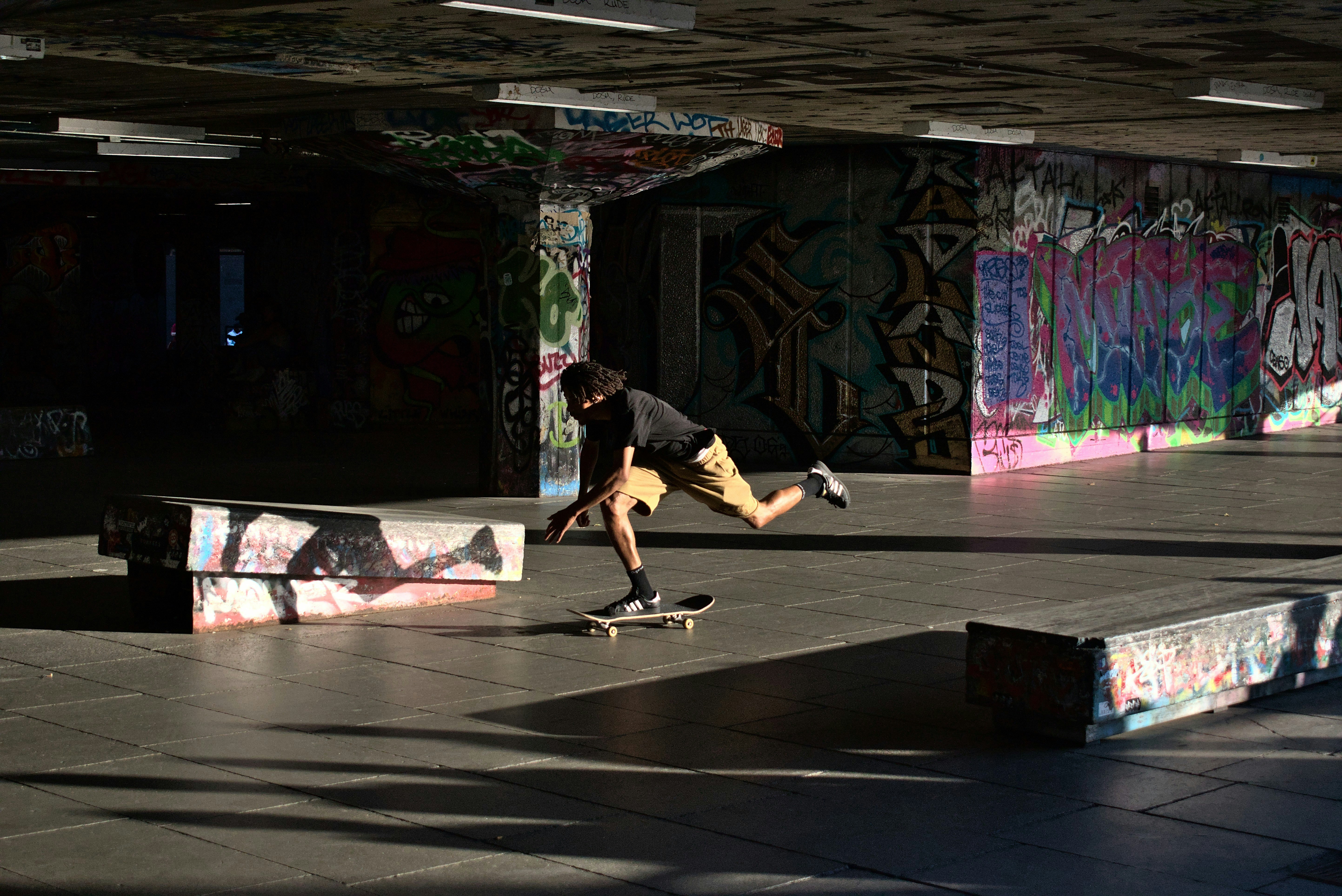 Sunlit Glide Through a Graffiti Underpass