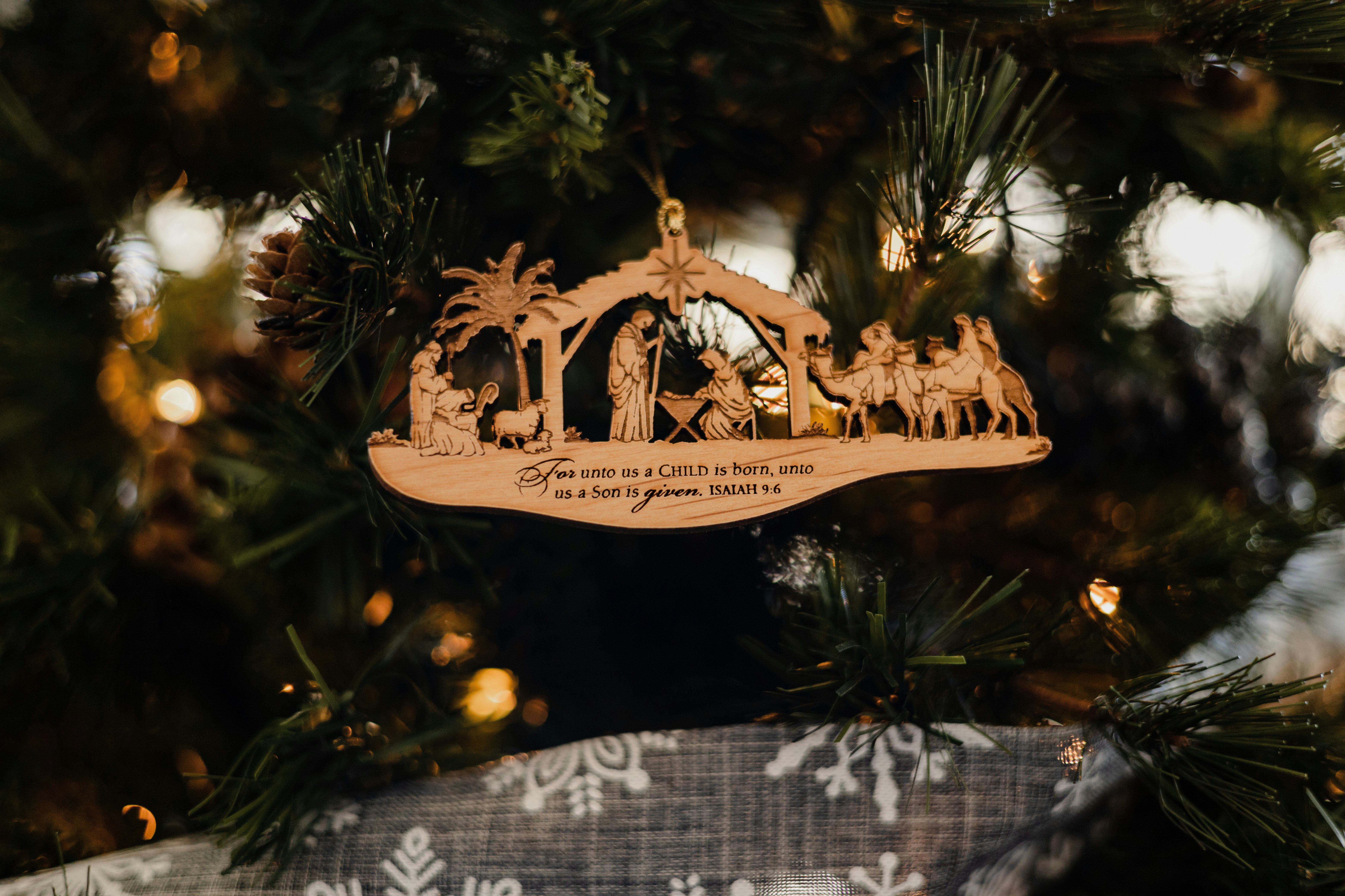 a christmas ornament hanging from a christmas tree
