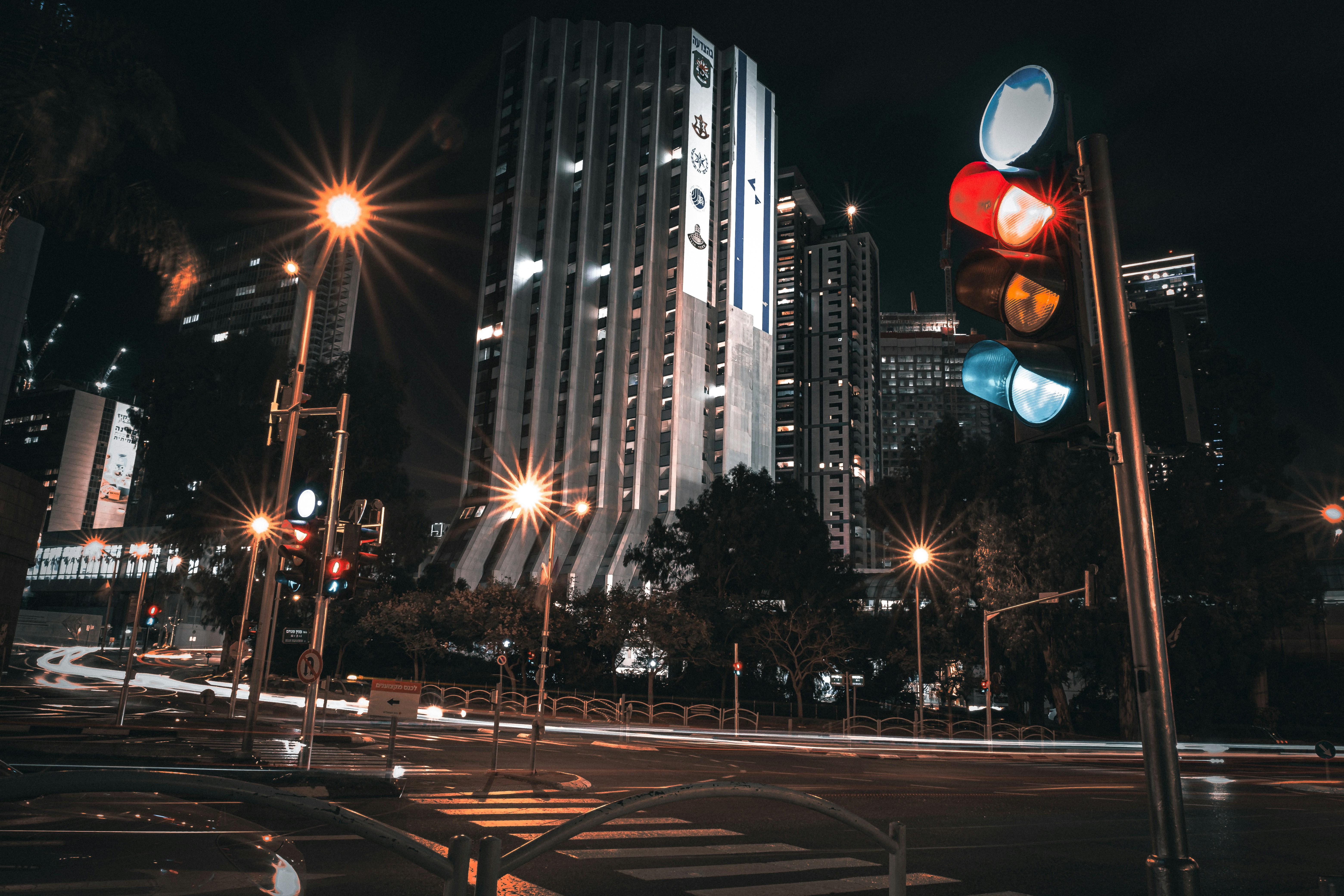 A traffic light sitting on the side of a road photo – Free Tel aviv ...