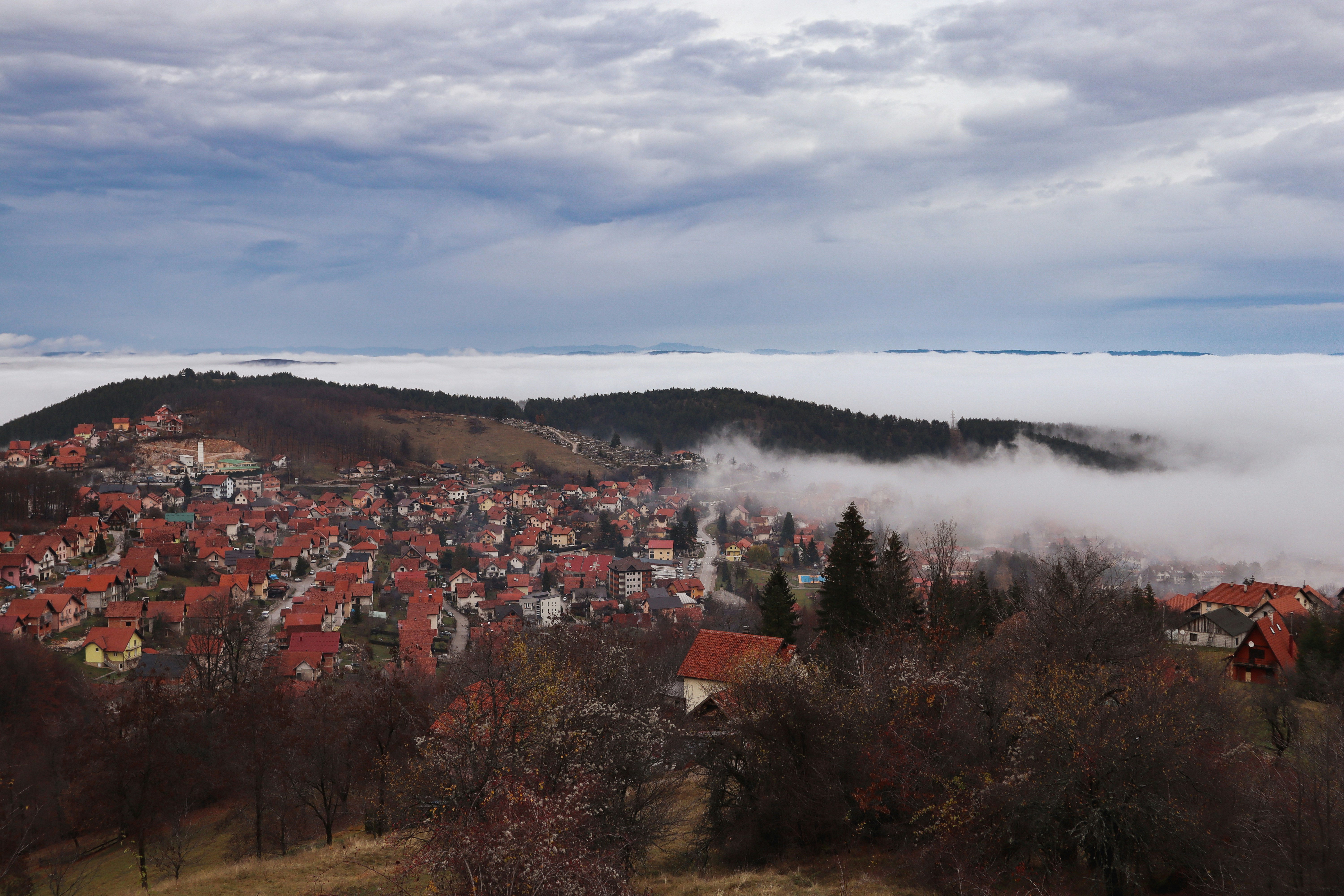 Whispers of the Valley: A Town Embraced by Clouds