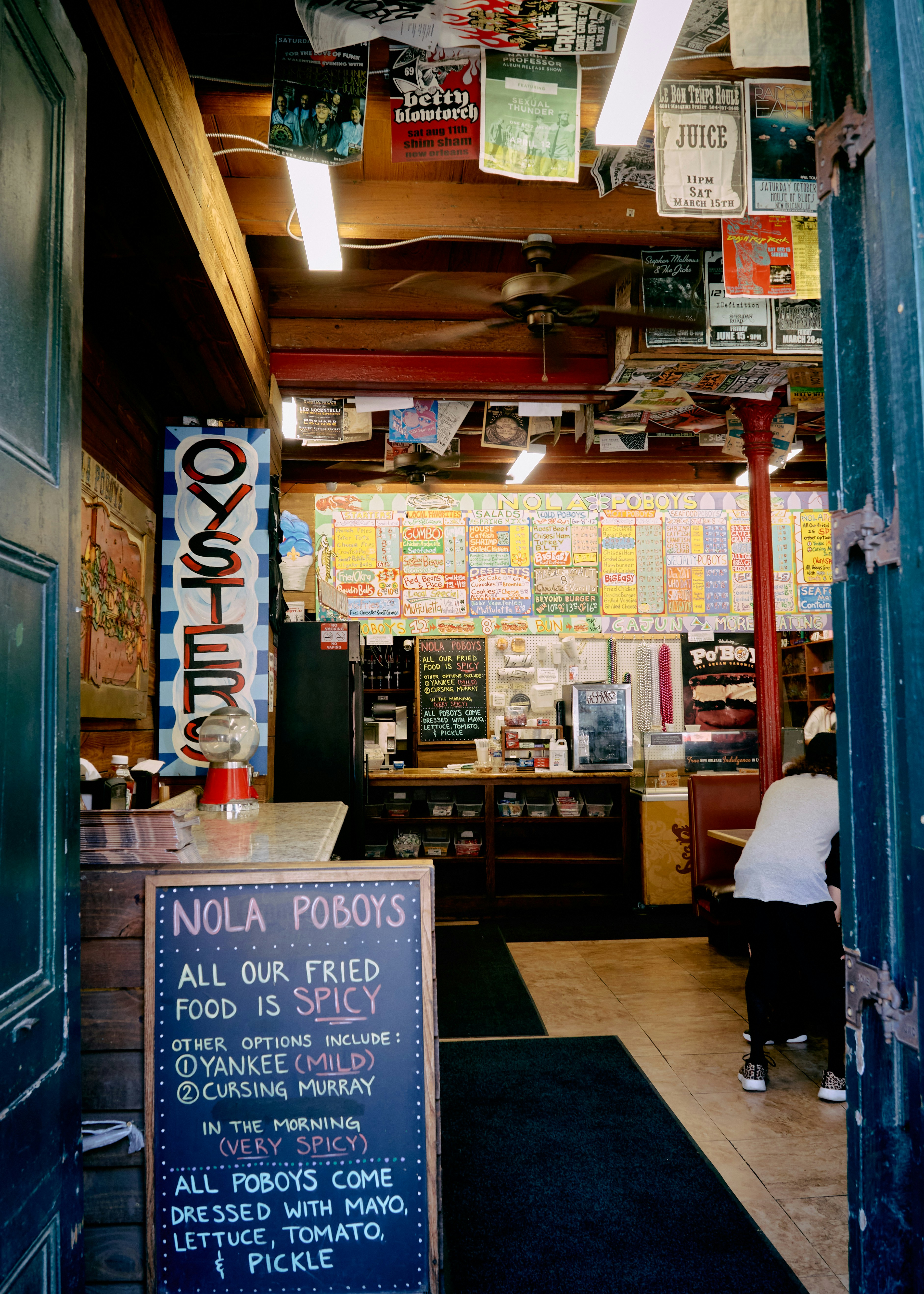 A restaurant with a menu hanging from the ceiling photo – Free ...