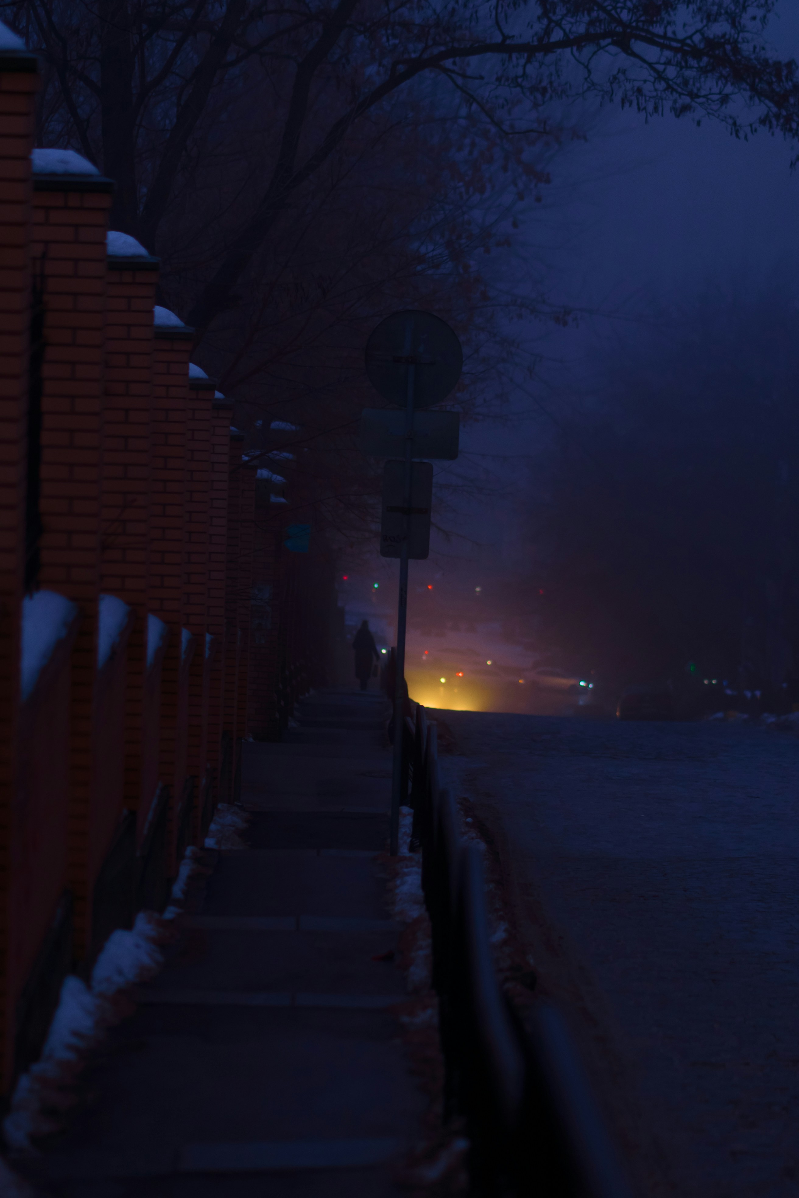Blue Hour Along the Snow-Lined Canal Wall: Quiet Walk in Fog