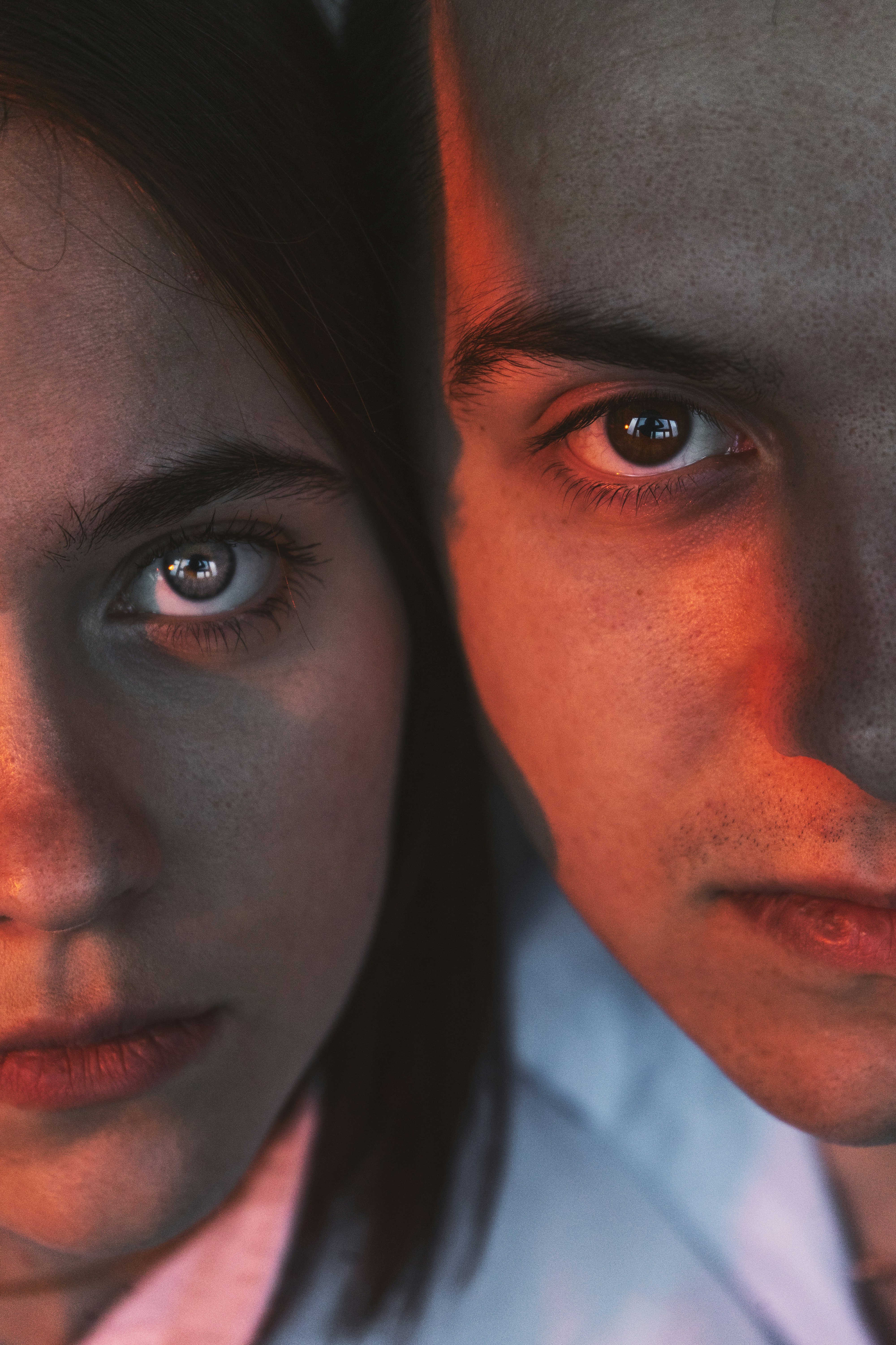 Dual Gaze in Redlight: Close-Up of Two Faces