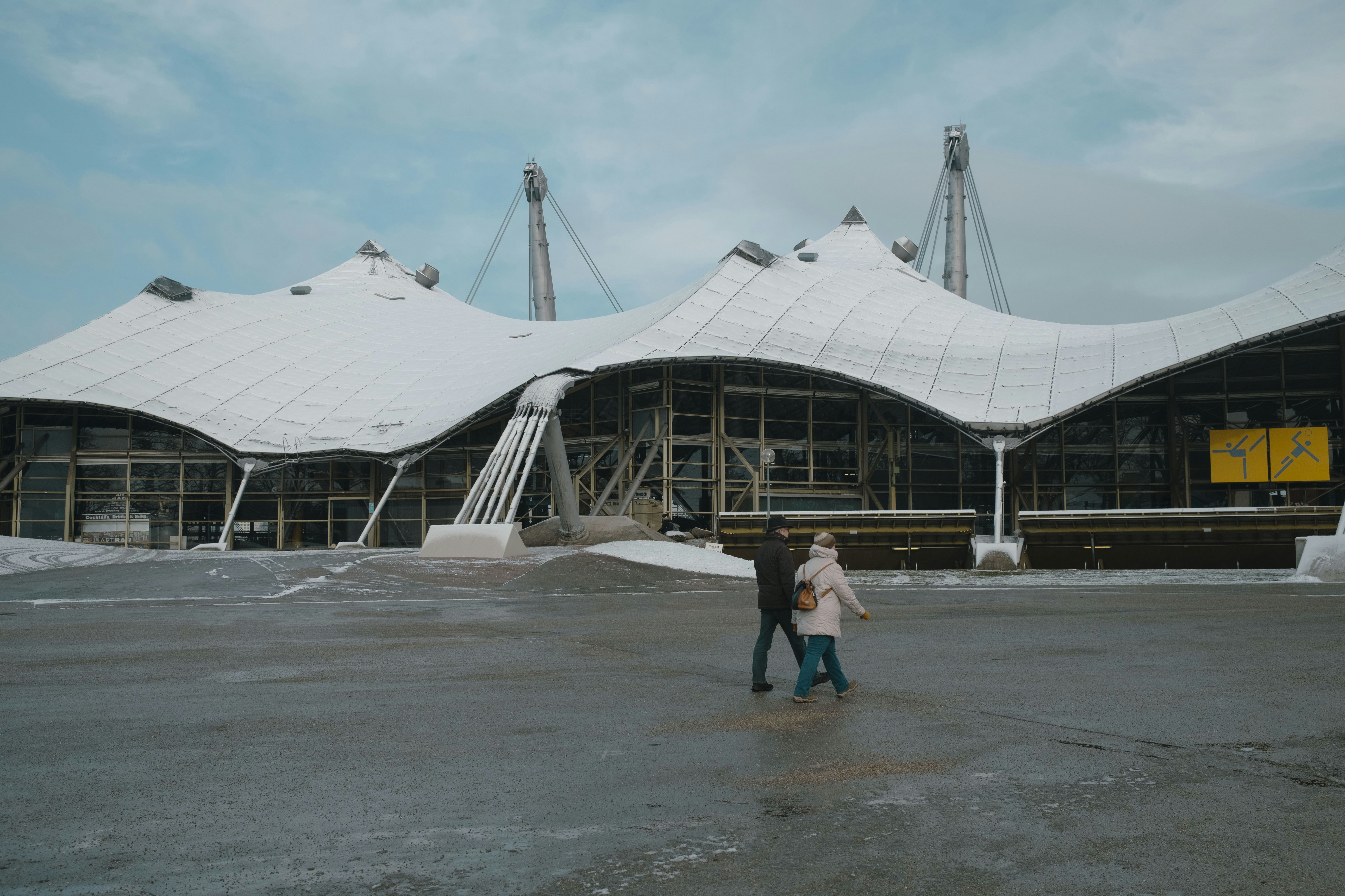 Snowy Footsteps Before the Wave-Lined Air Terminal