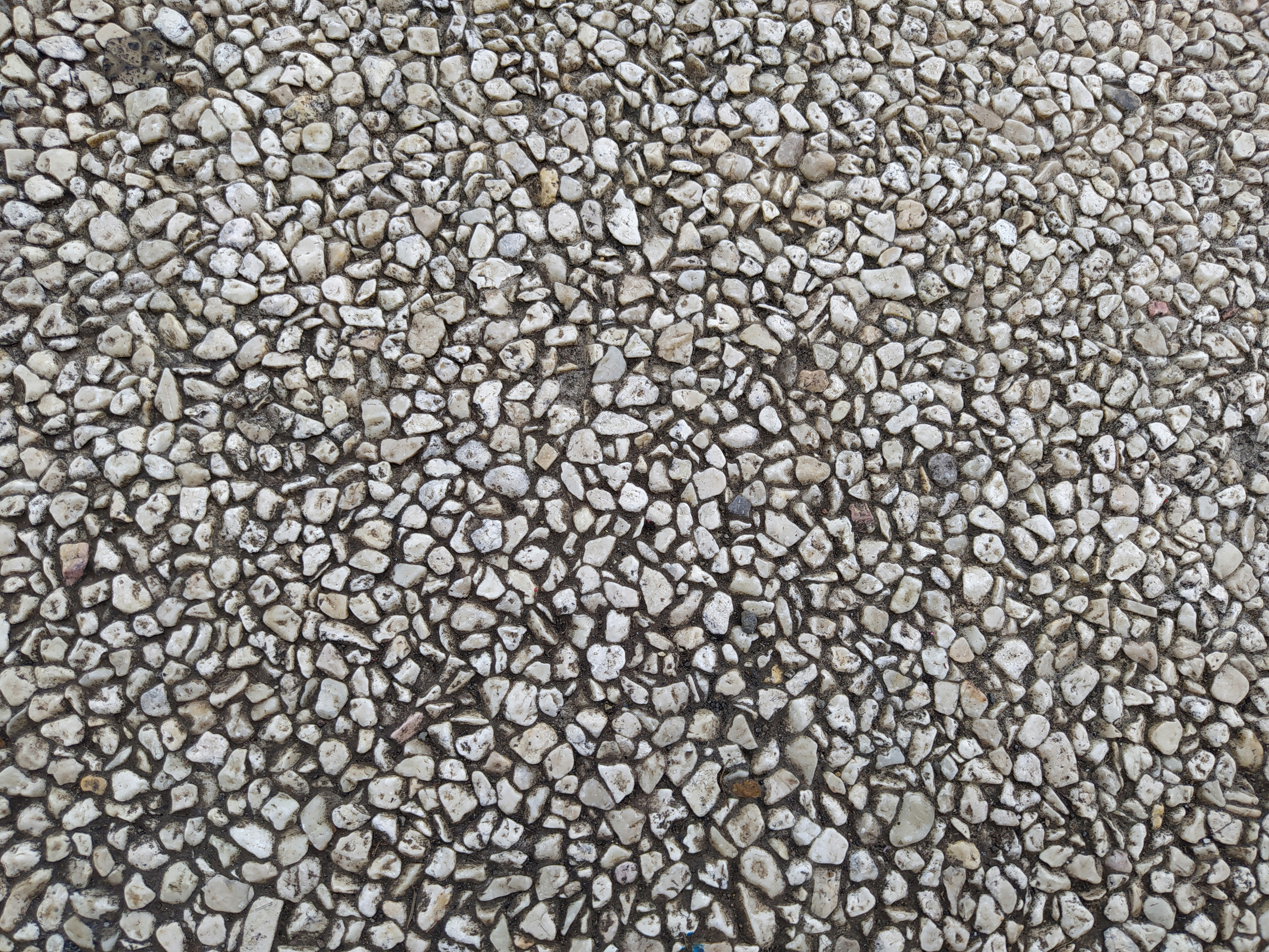 Grey Gravel Mosaic: A Close-Up of Pebble Texture