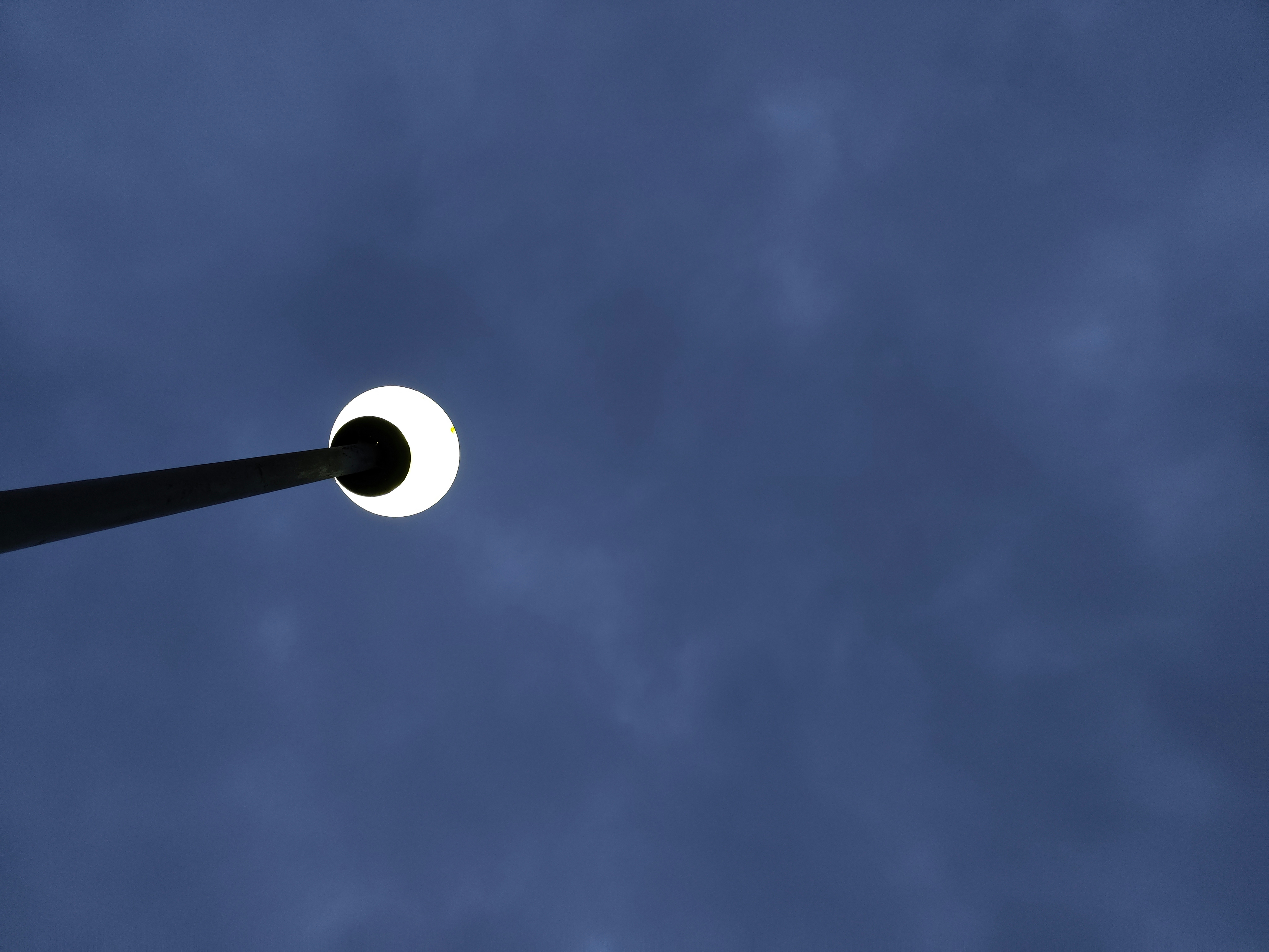 Lone Ring of Light against Evening Sky
