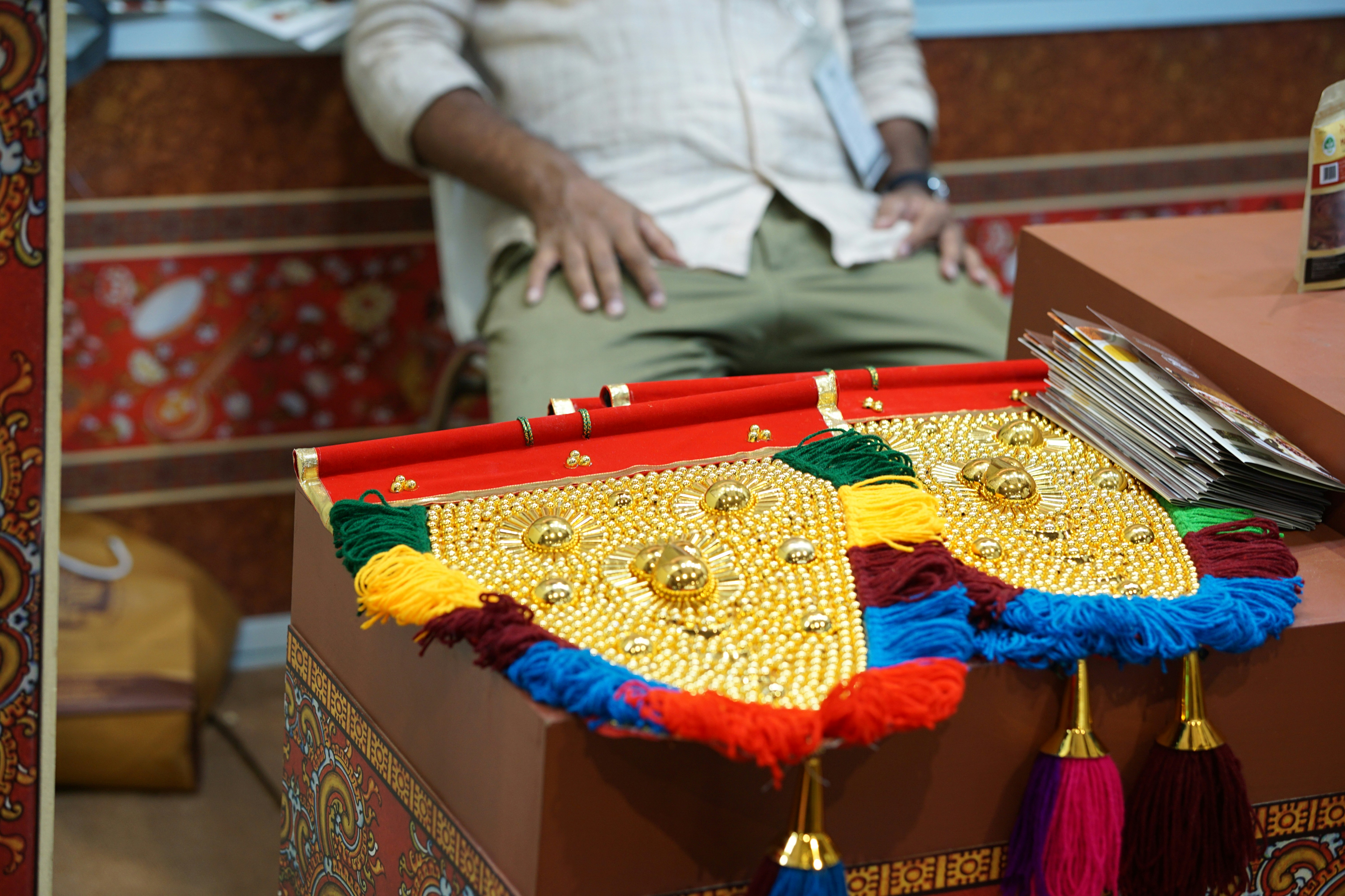 Gilded Beadwork and Multicolor Tassels Adorn a Carved Chest