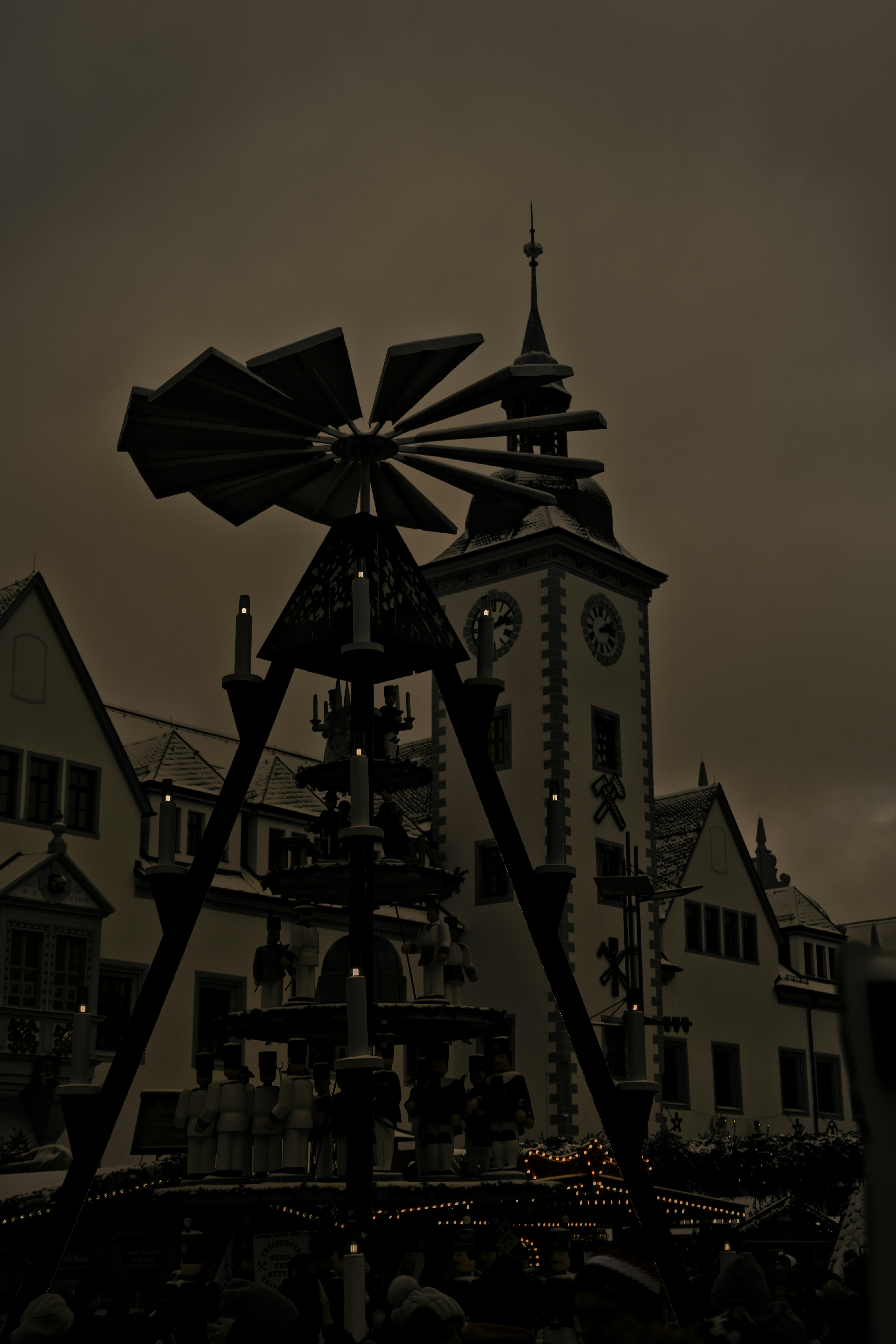Sepia Festival: An Iron Windmill Framed by the Clocktower in the Town Square