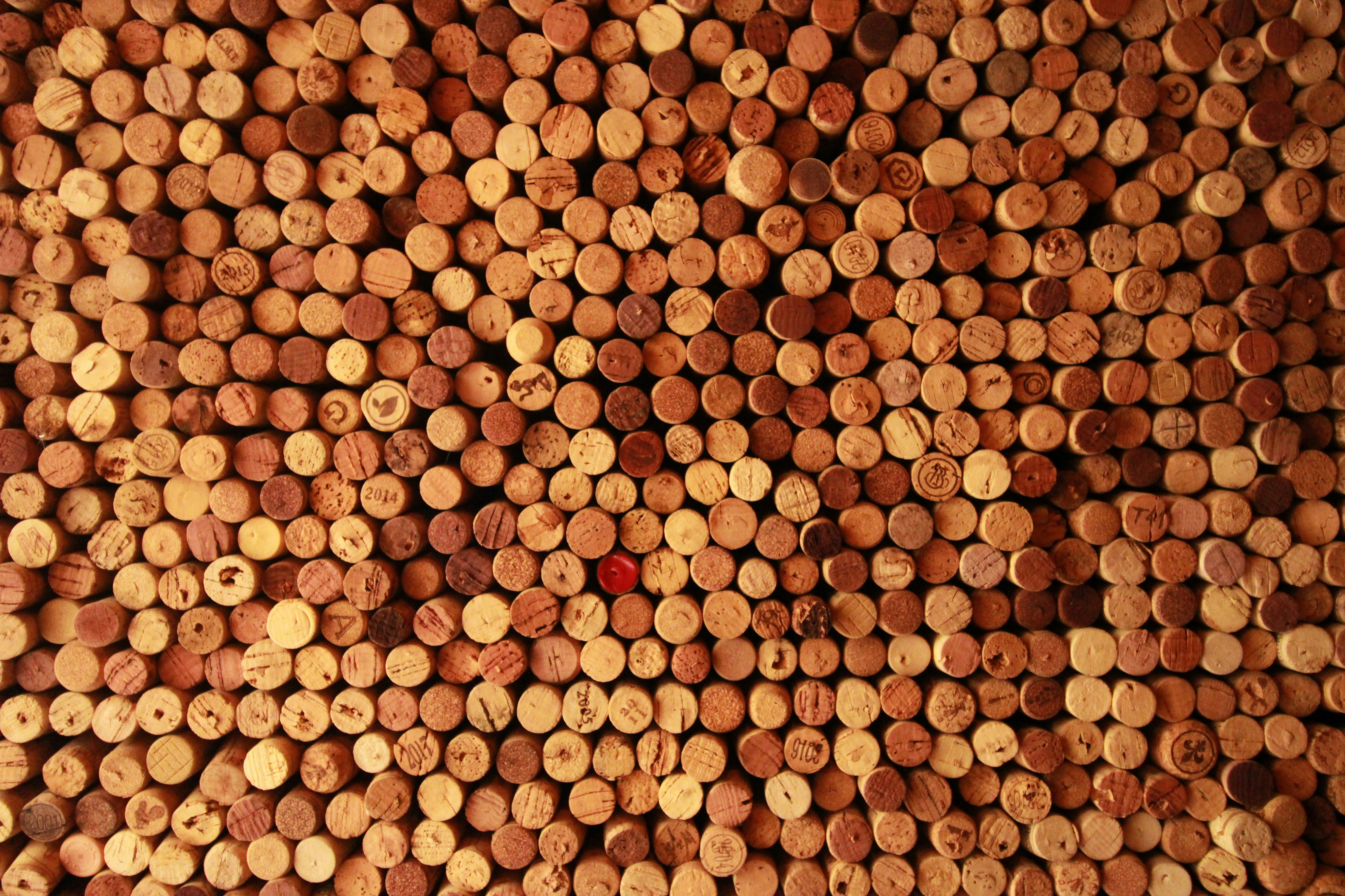 A large amount of wine corks are stacked on top of each other photo ...