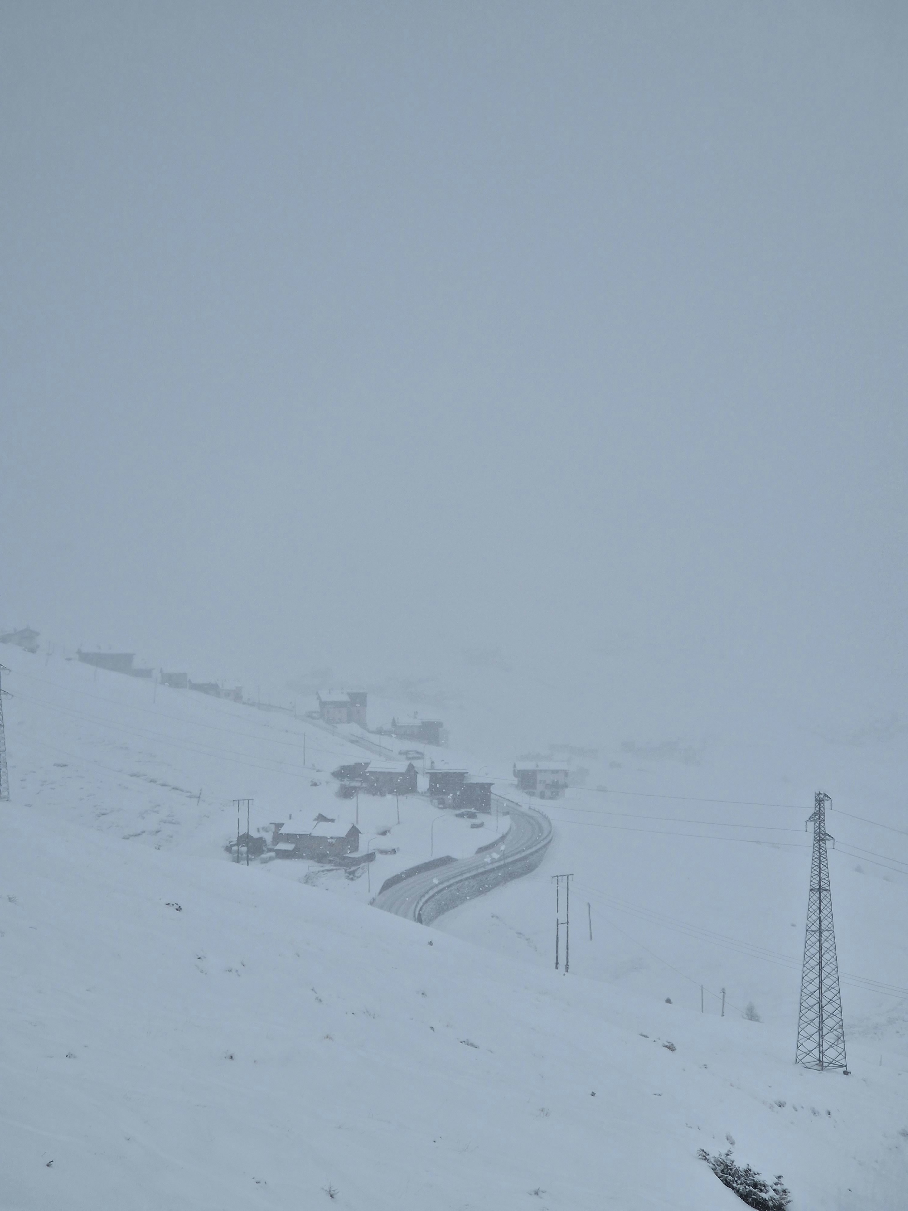 a snow covered hill with a train on it