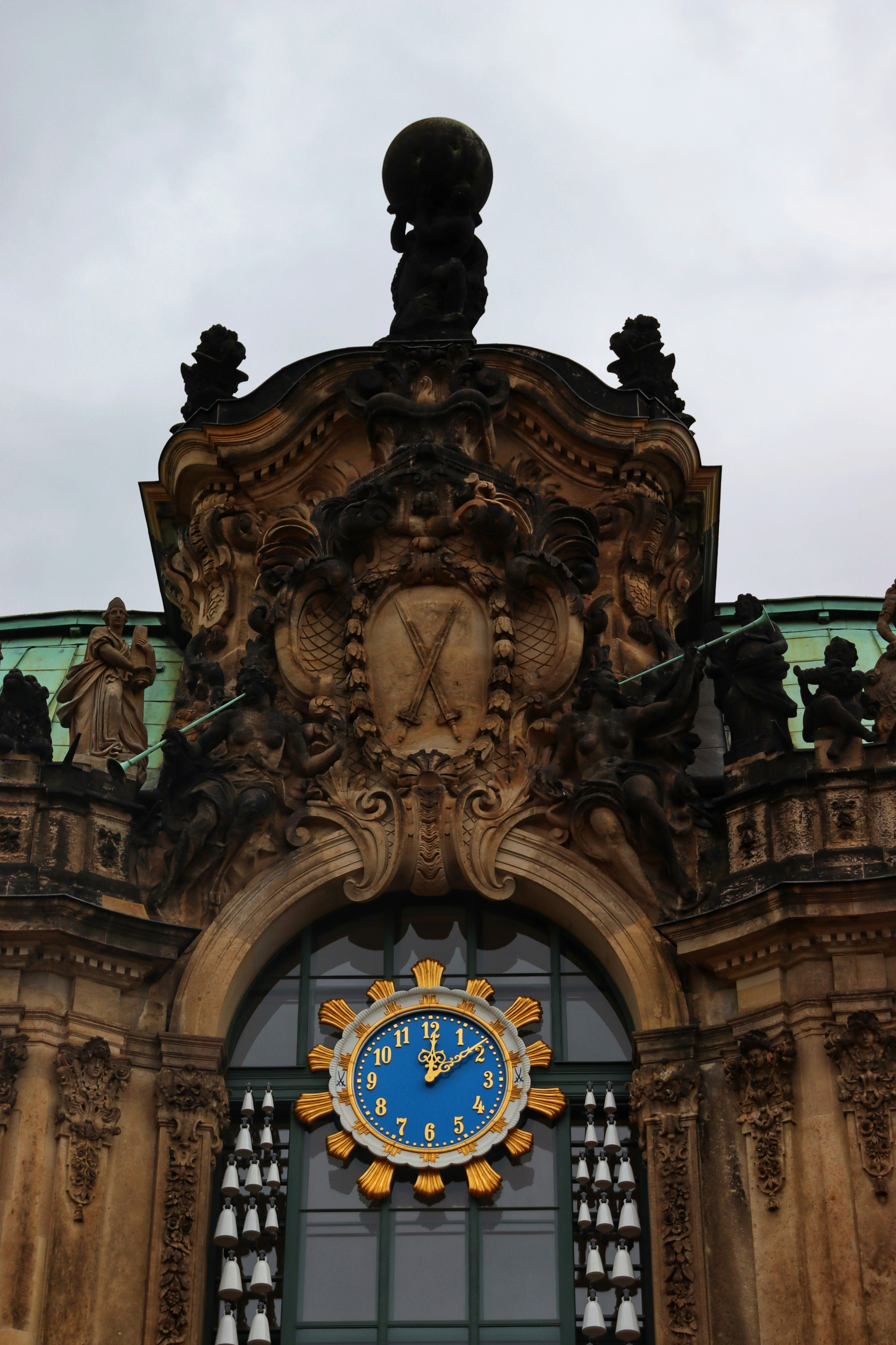 Blue Dial on a Baroque Façade: Time Framed by Sculpted Ornament
