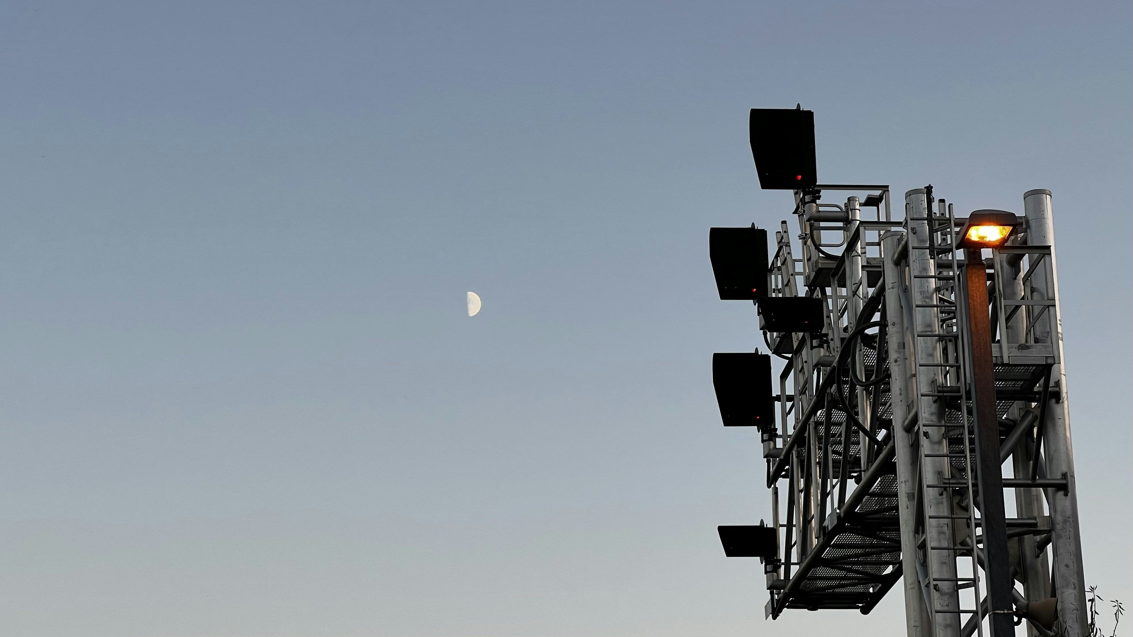 Moonrise over the steel scaffold: a quiet skyline moment