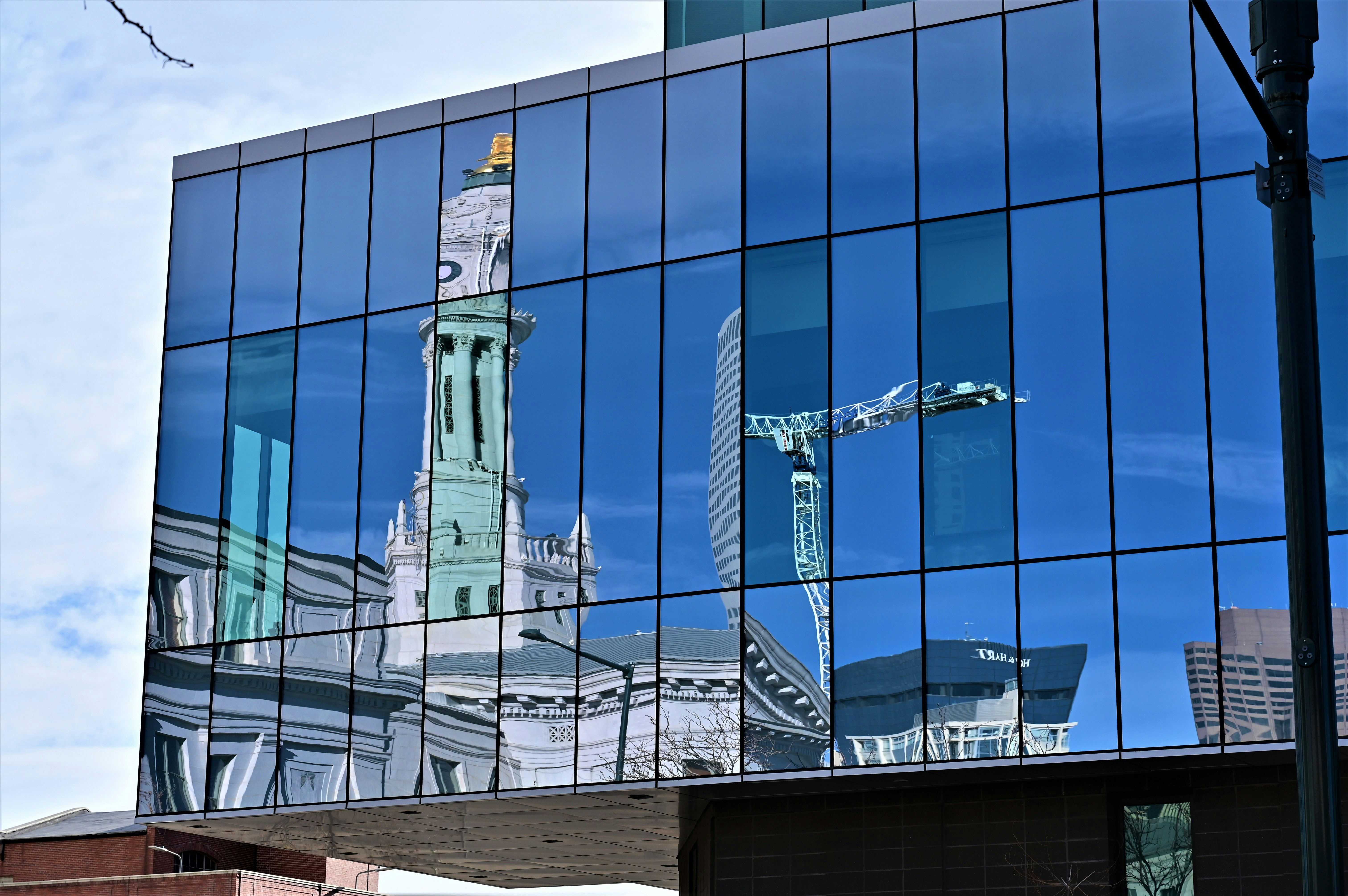 A reflection of a building in the glass of another building photo ...