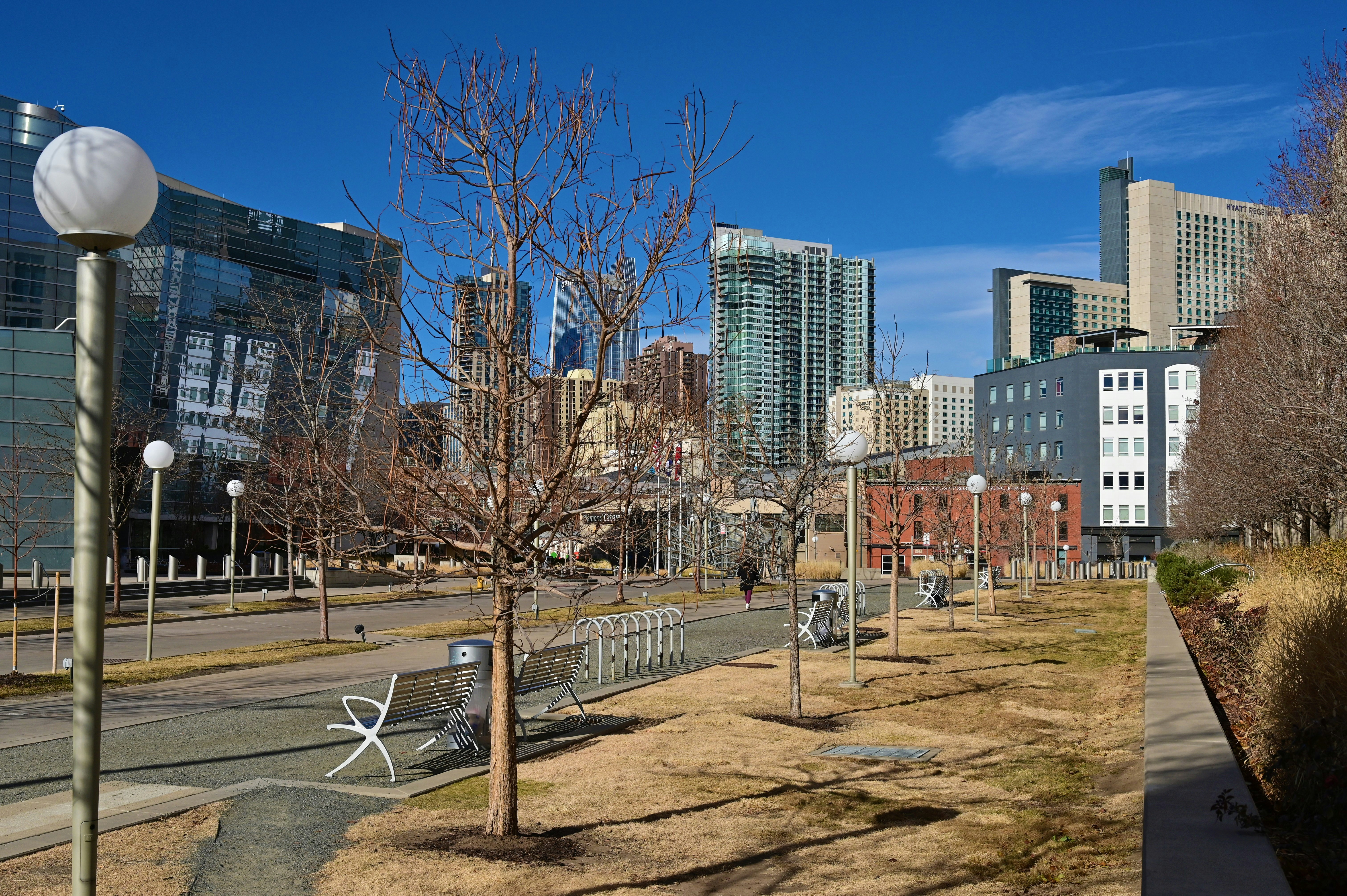 A view of a city with tall buildings in the background photo – Free ...