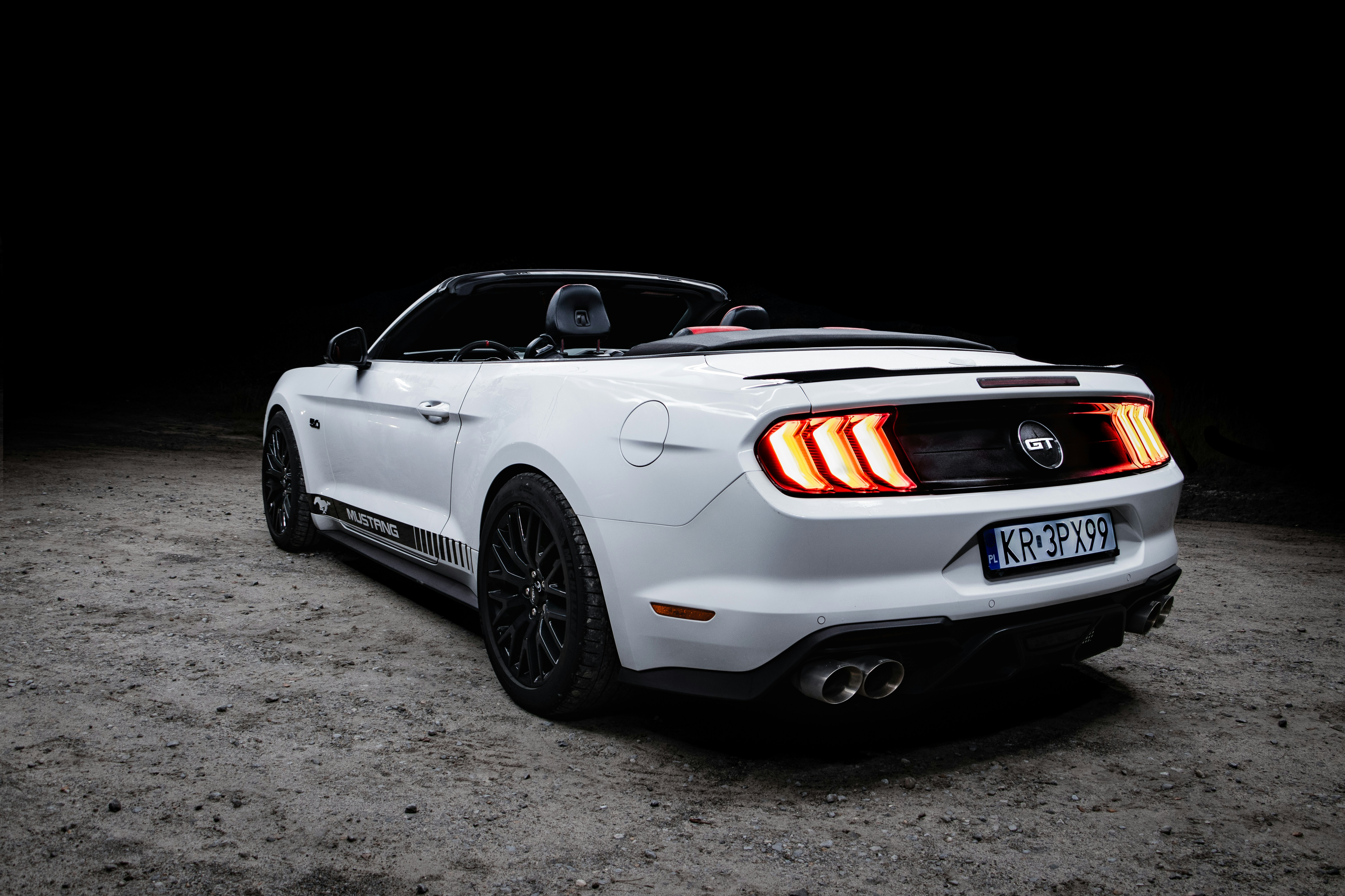 A white mustang convertible parked in the dark photo – Free Poland ...