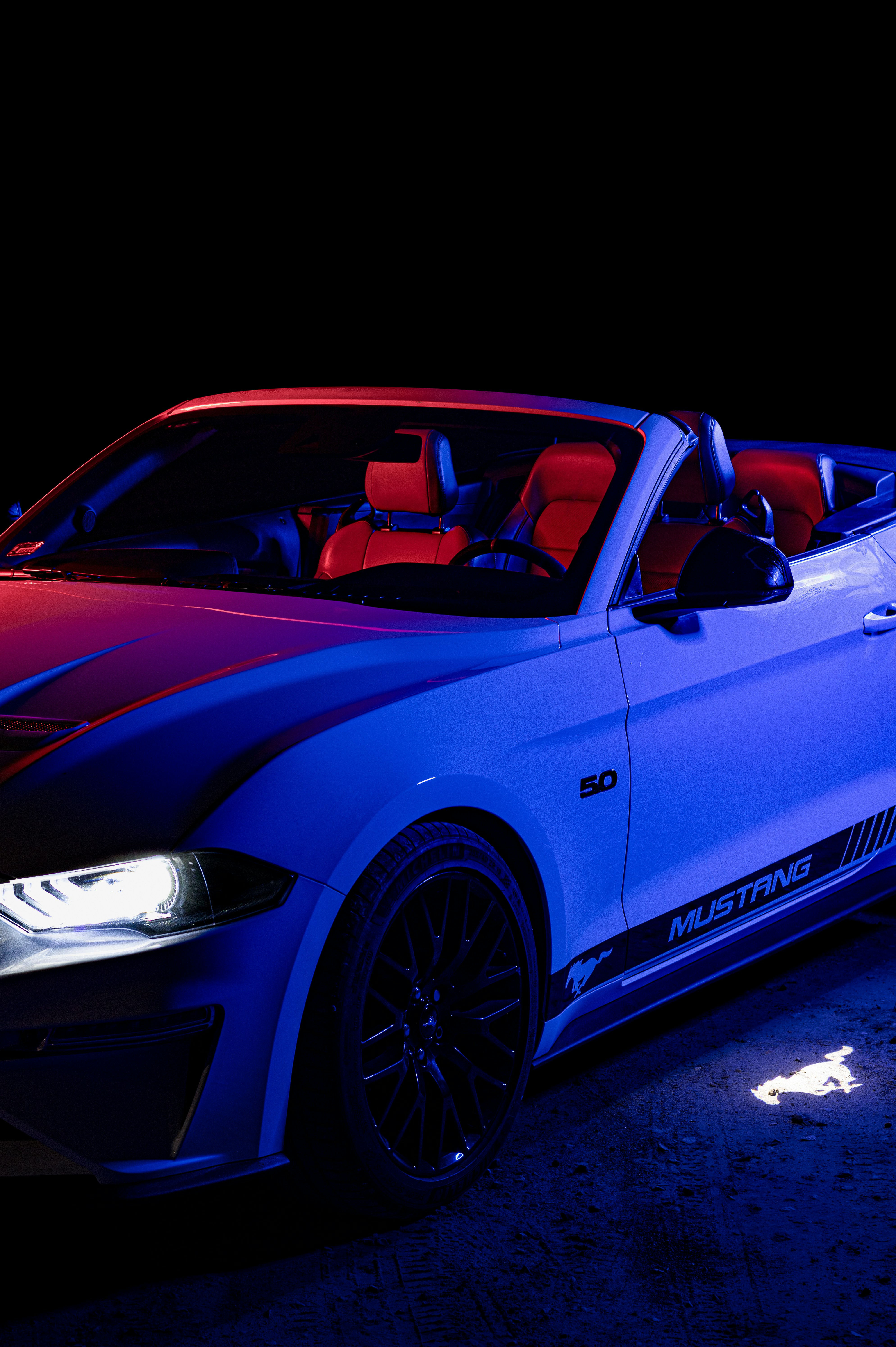 Red-Blue Convertible: Twilight Ride with Neon Accents