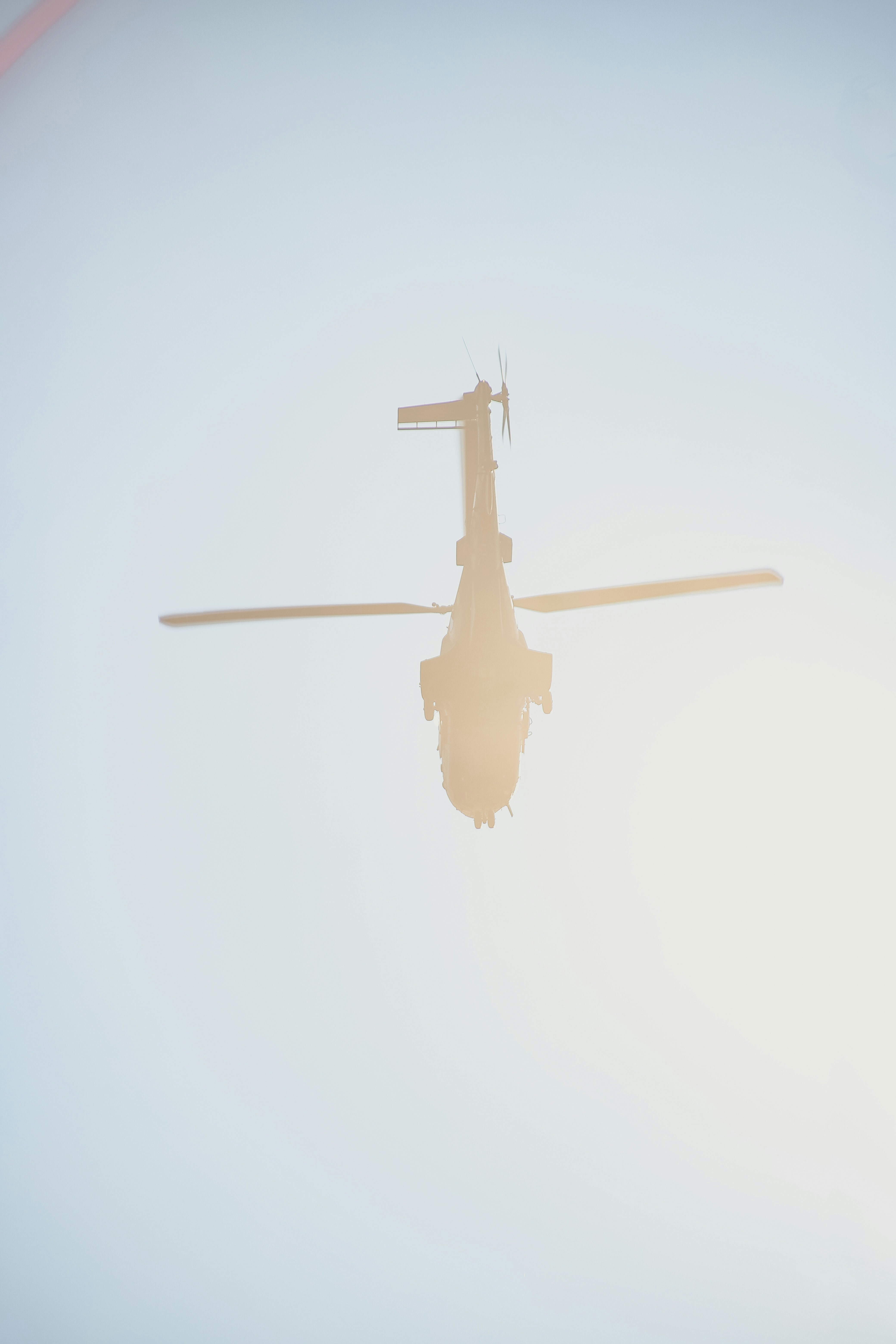 Helicopter during WW2 Market Garden Memorial | a plane flying in the air with a sky background