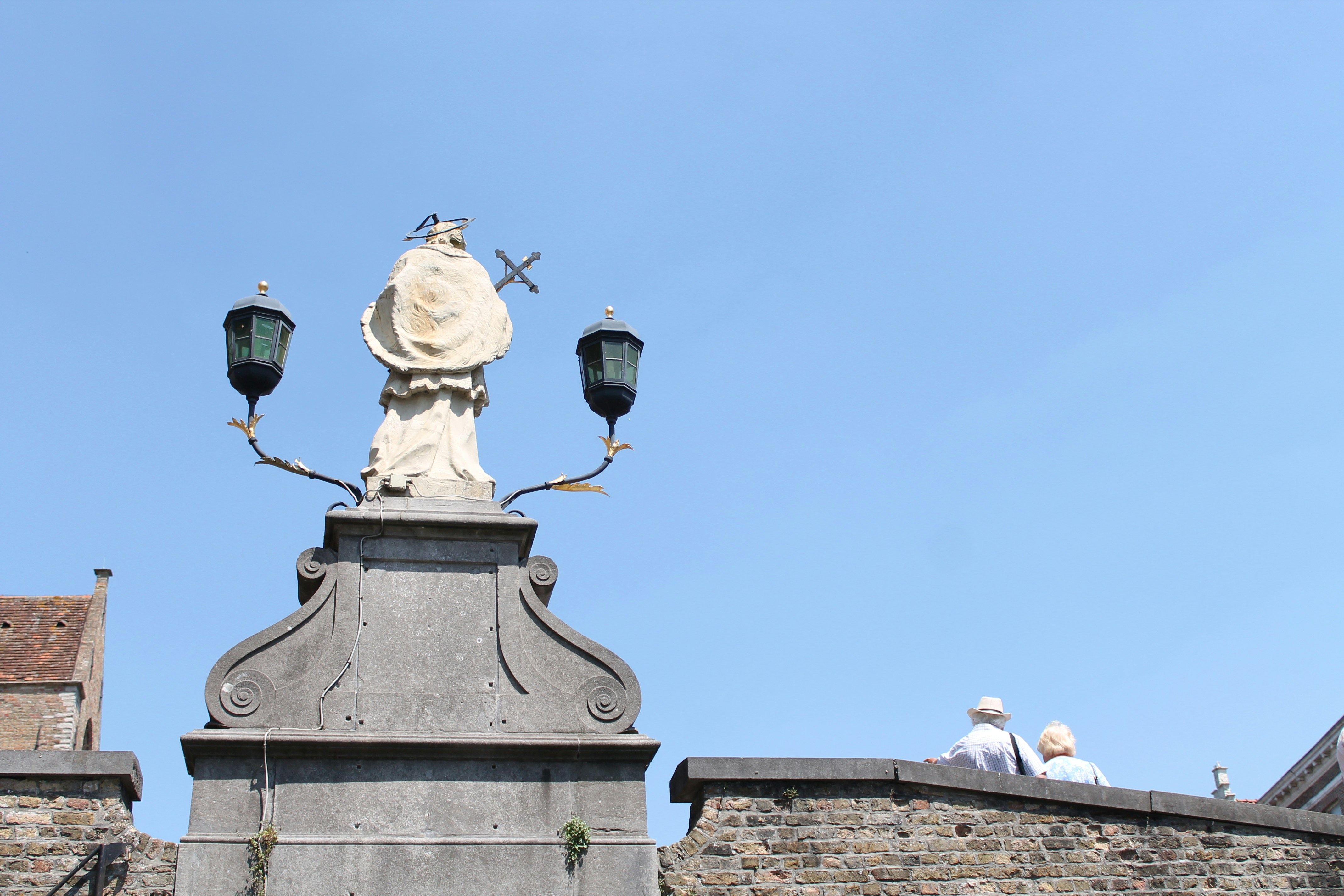 a statue of a woman on top of a building