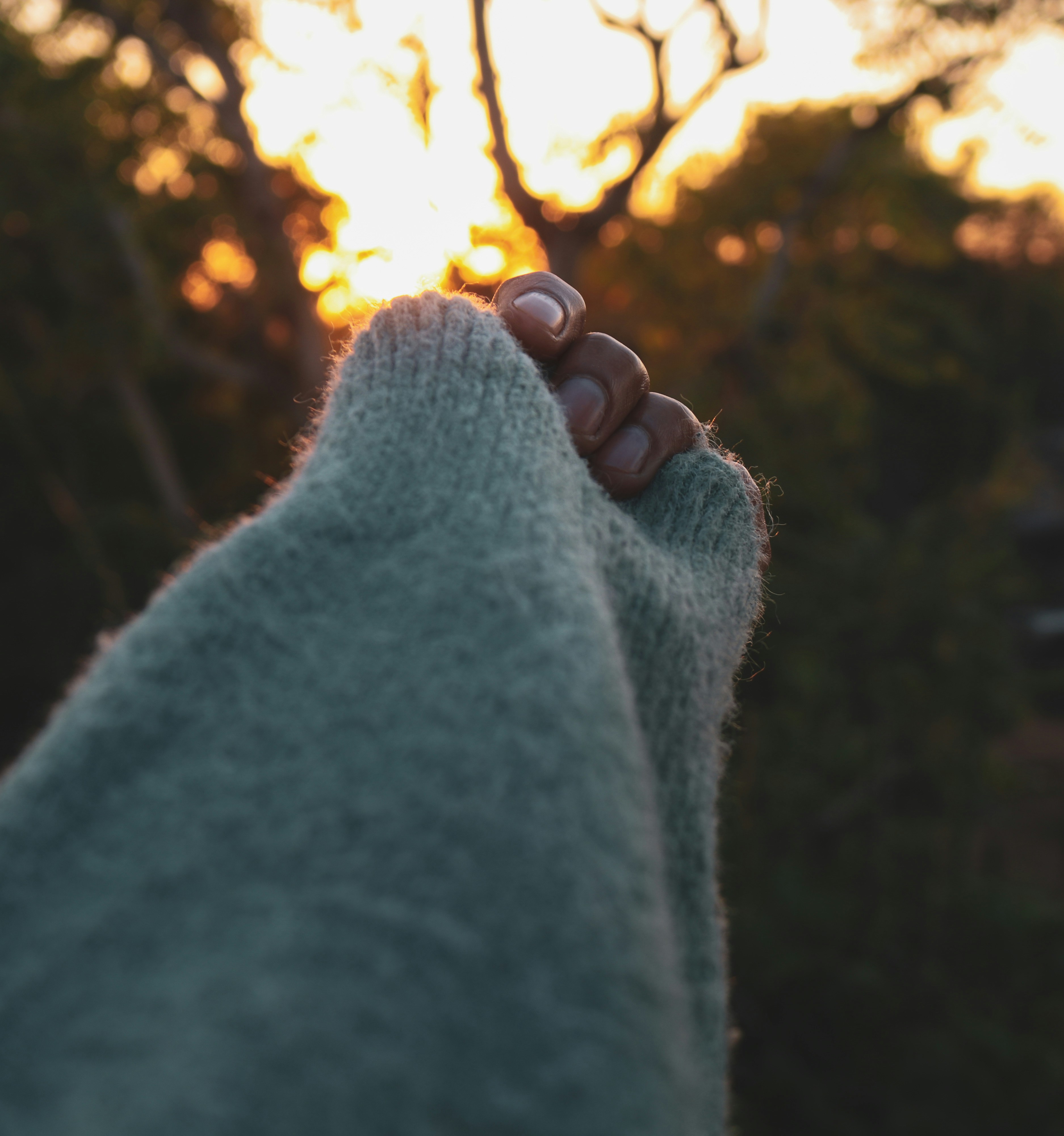 Horizon in Knit: a sleeve reaches toward sunset