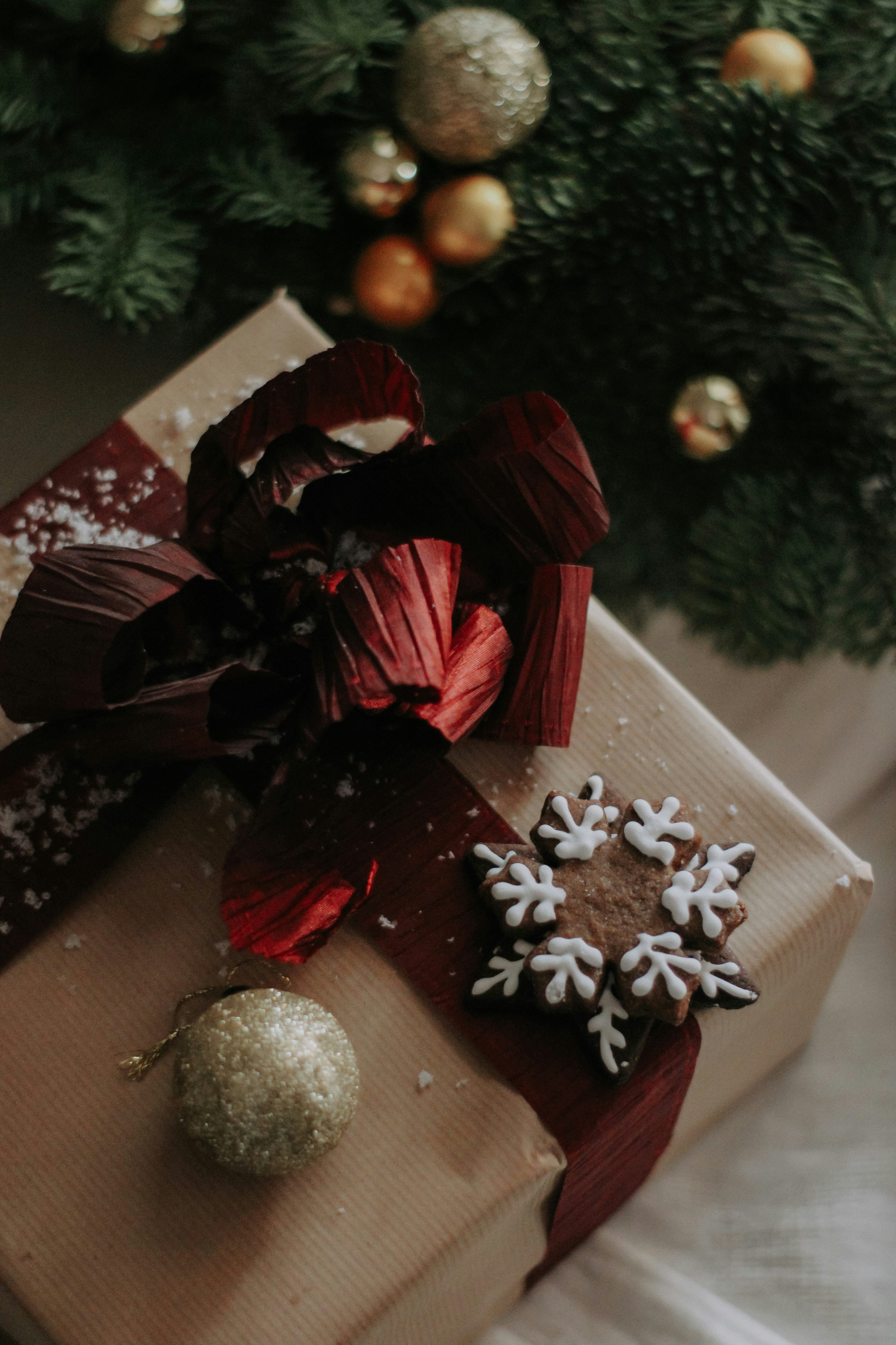A present wrapped in brown paper with a snowflake decoration photo ...