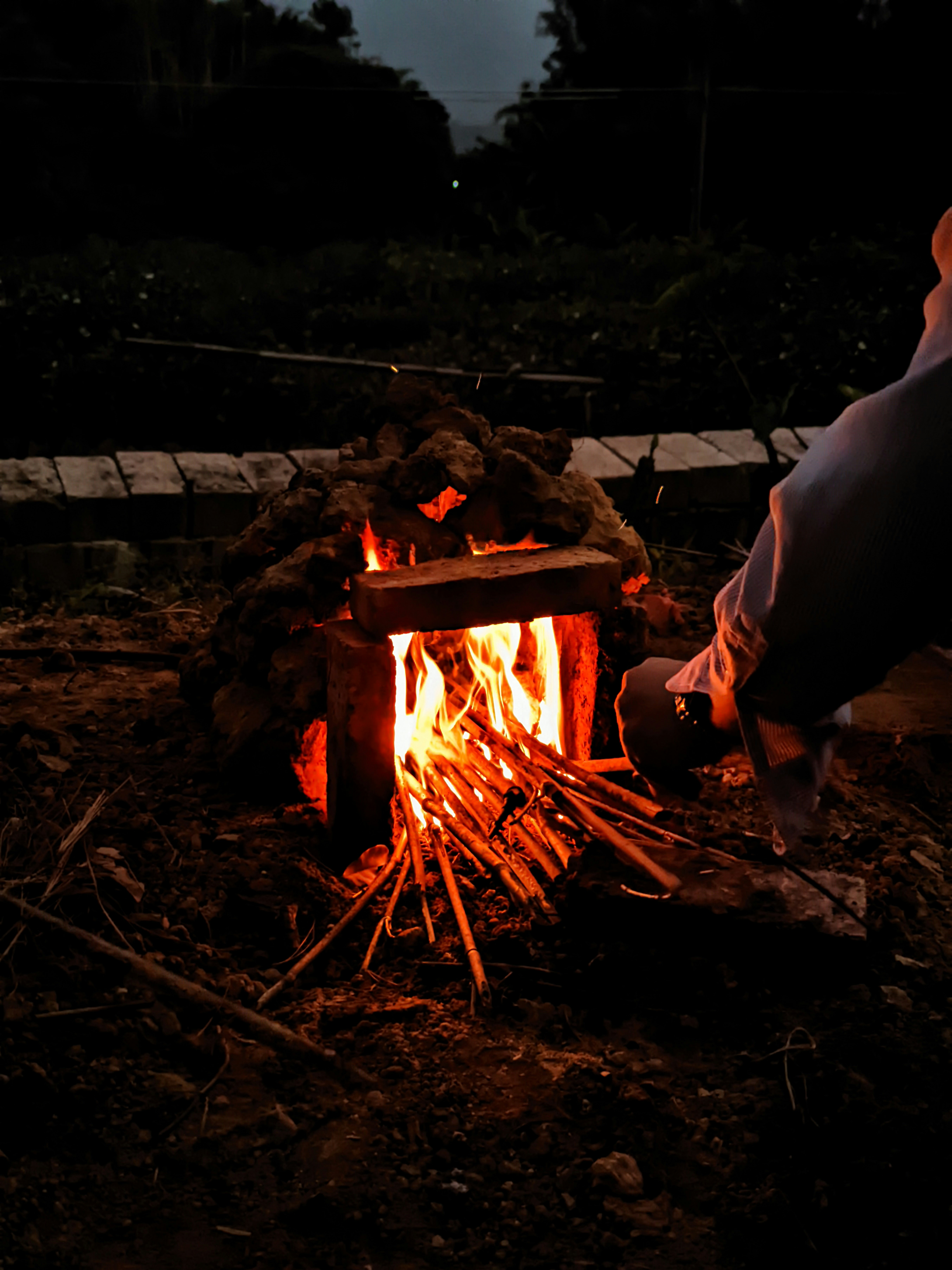 Cozy Ember Hands: Firelight on Dark Soil