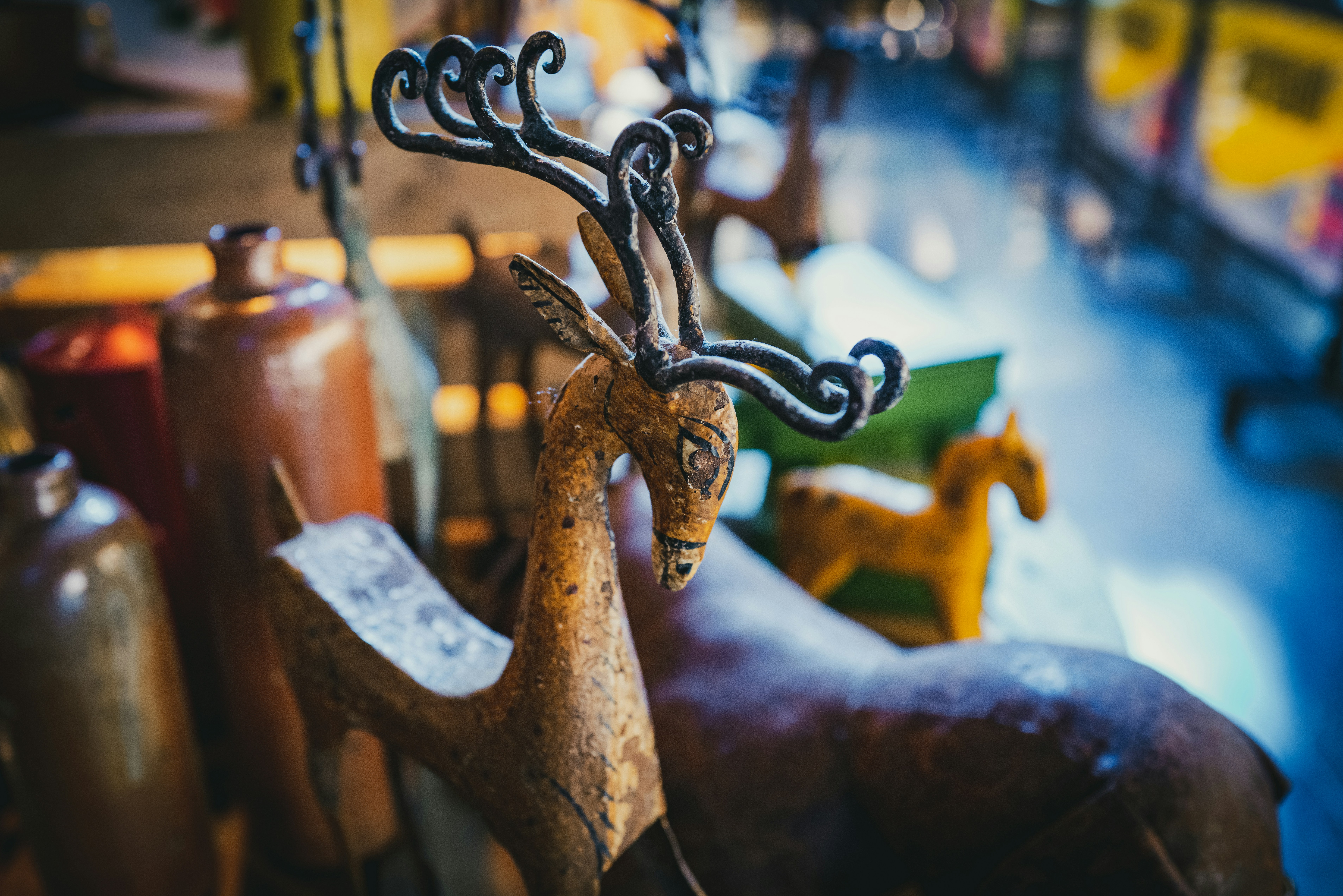 Curled Iron Ornament on a Weathered Market Horse at Neon Dusk