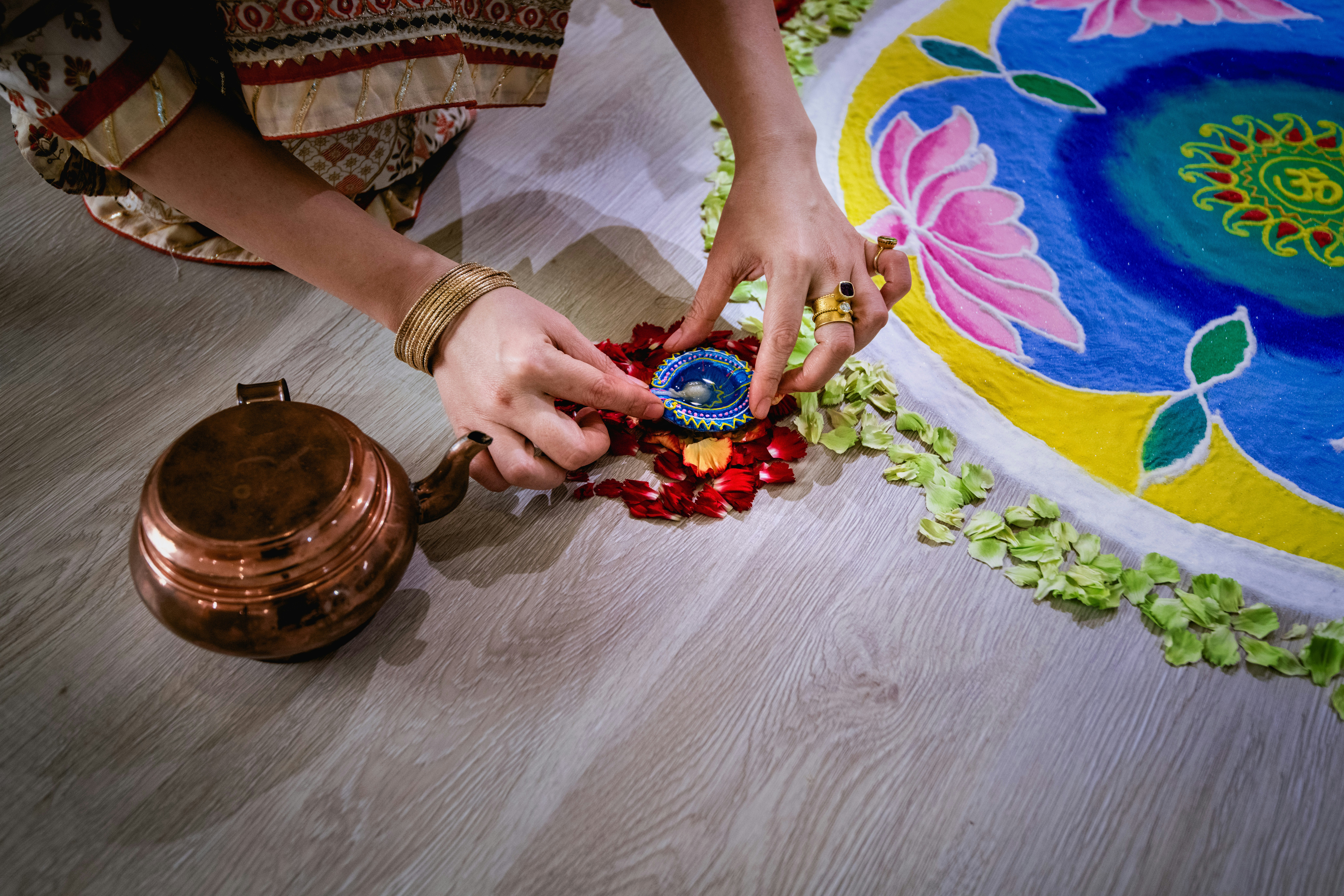 a woman is decorating a table with flowers