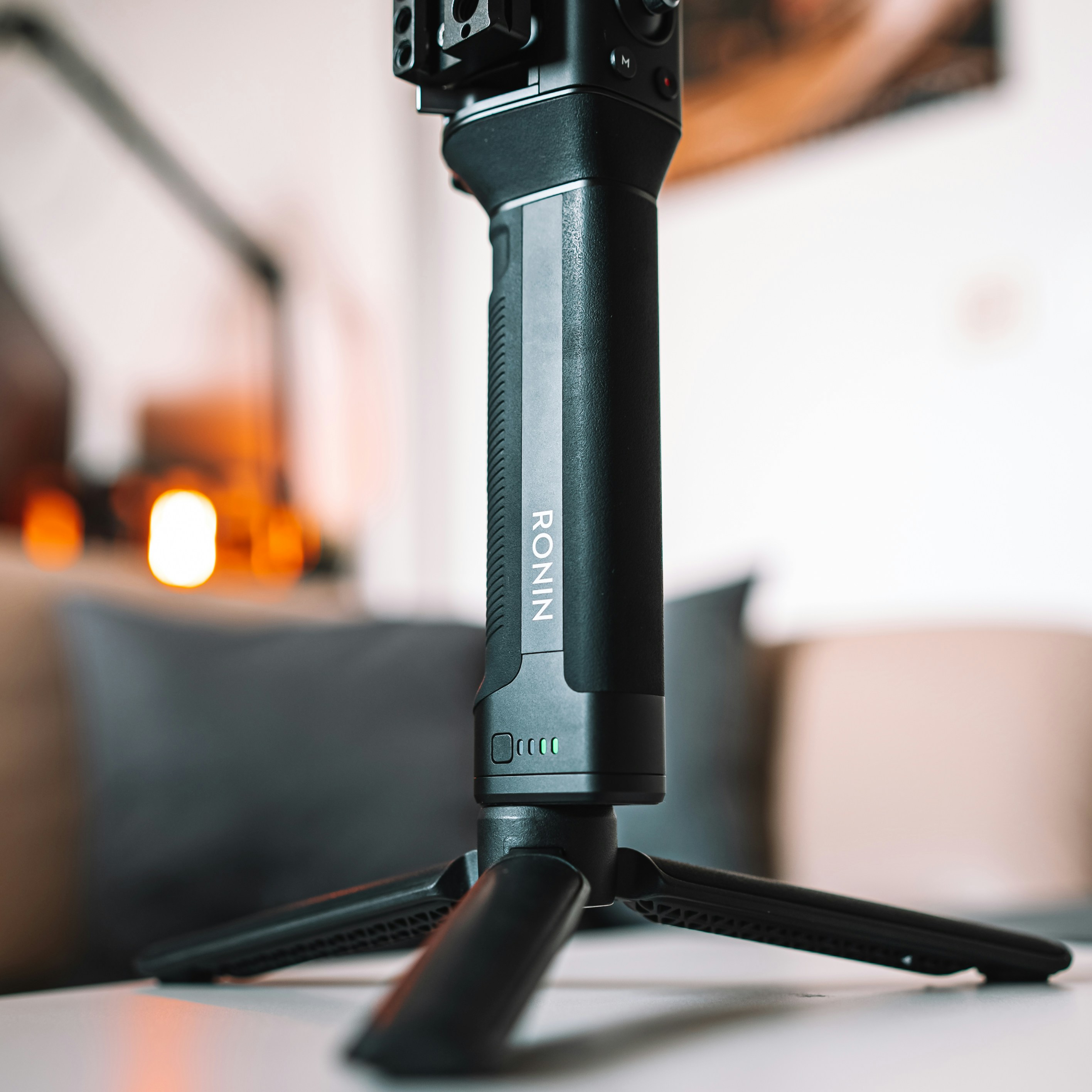 A camera tripod sitting on top of a table photo – Free Camera Image on ...