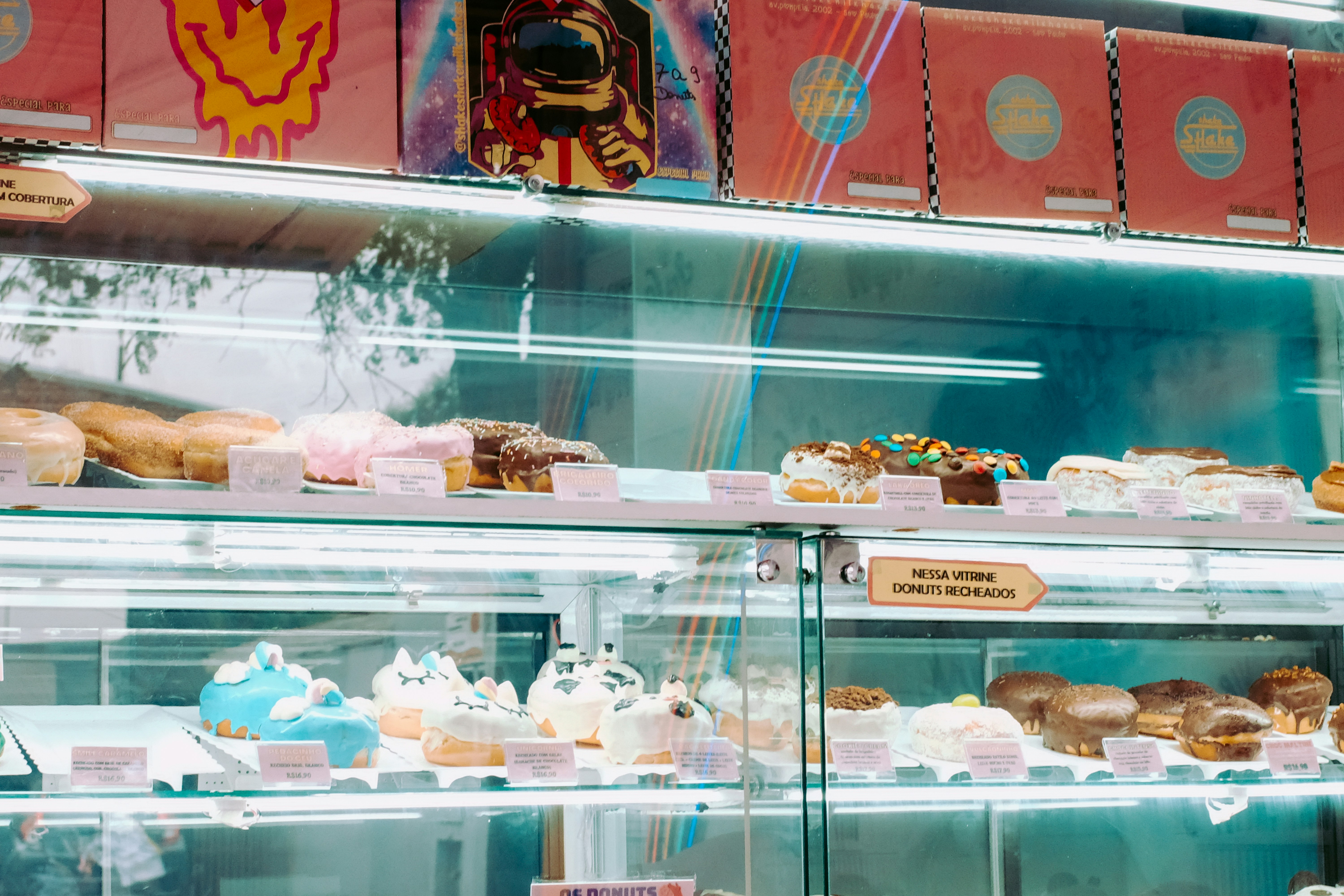 Cerulean Donuts Under Neon Glass: A Quiet Bakery Display