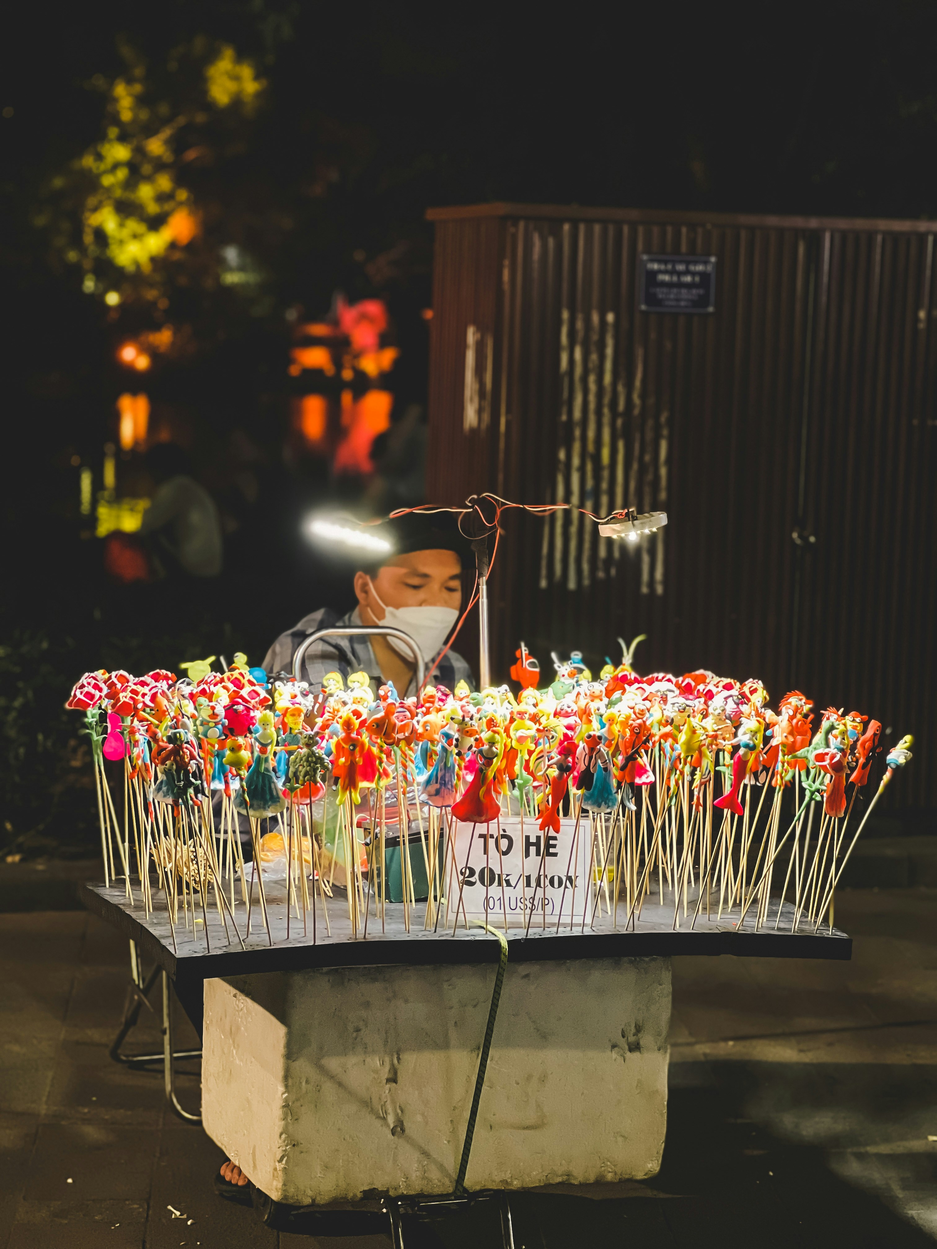 Candied Charms: A Night Market Display Under Ambient Glow
