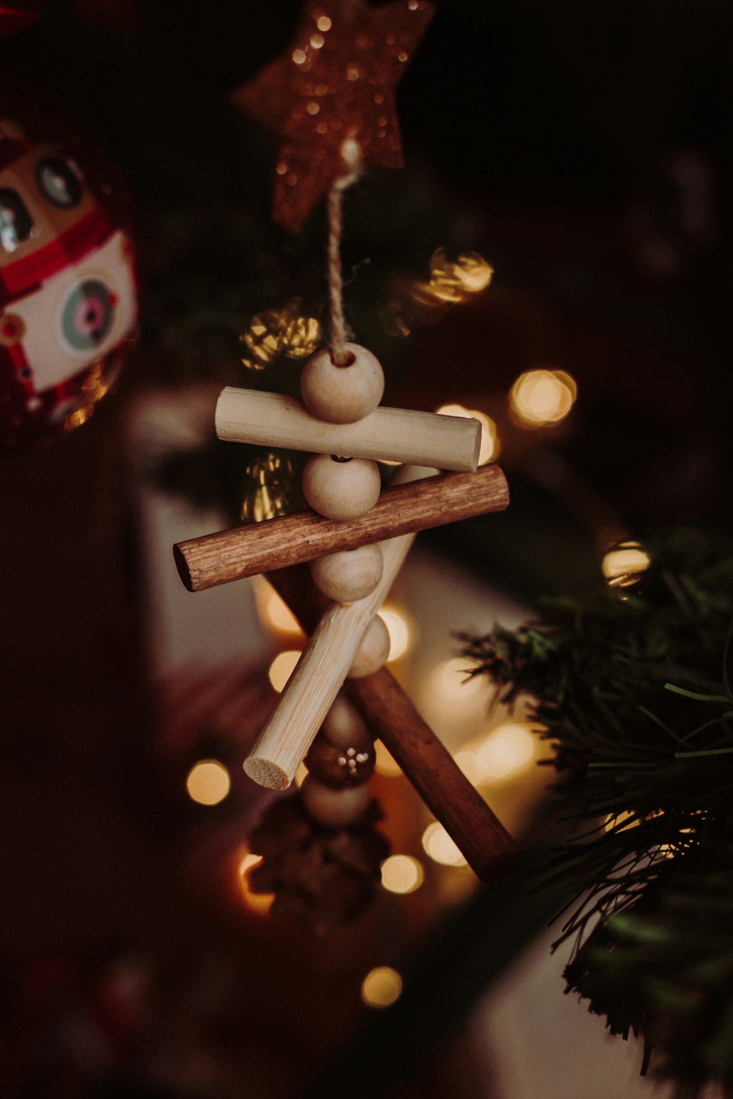 Whimsical Wooden Ornaments Amidst Twinkling Lights