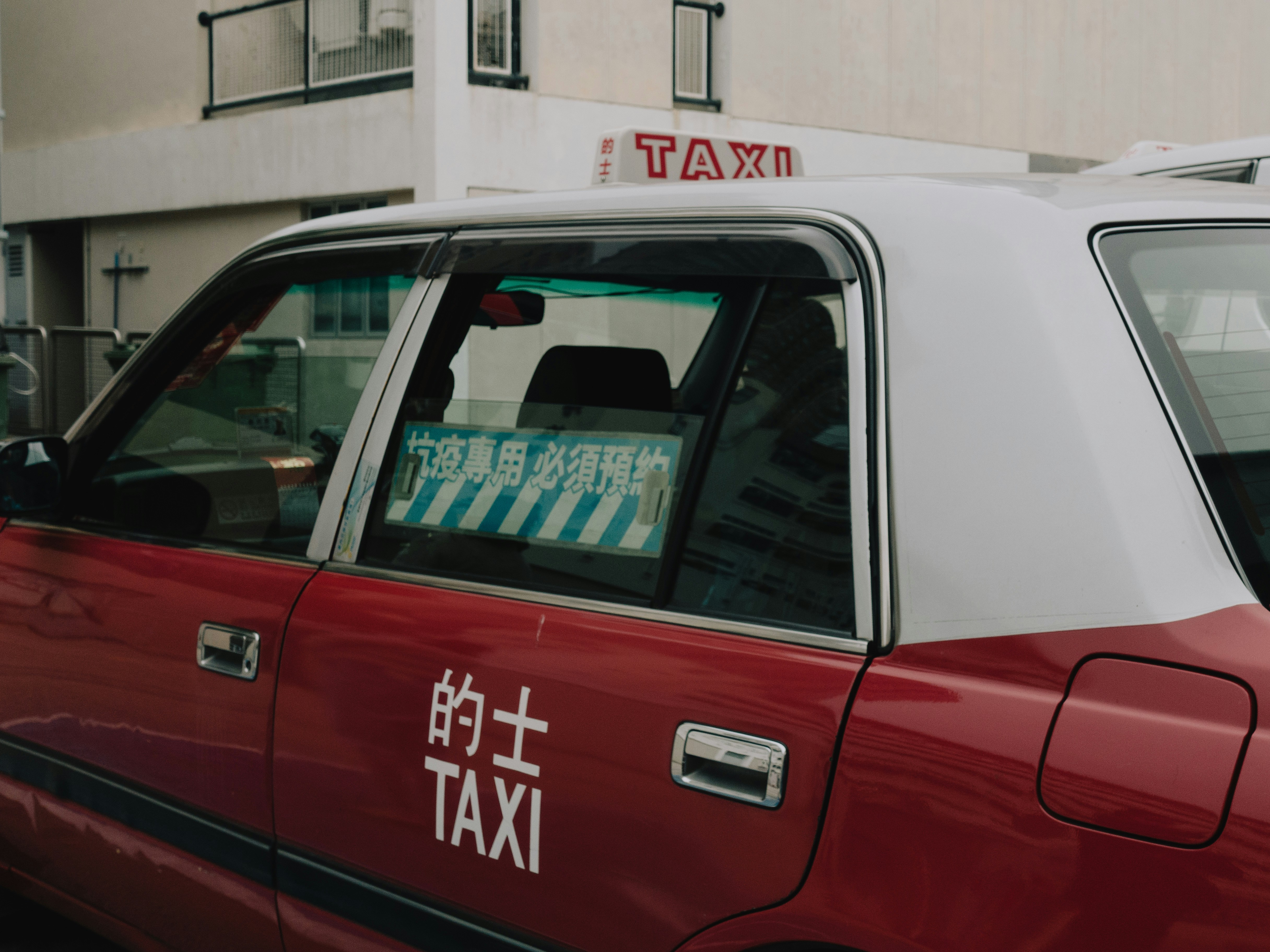 A taxi cab with a taxi sign on it's windshield photo – Free Hong kong ...
