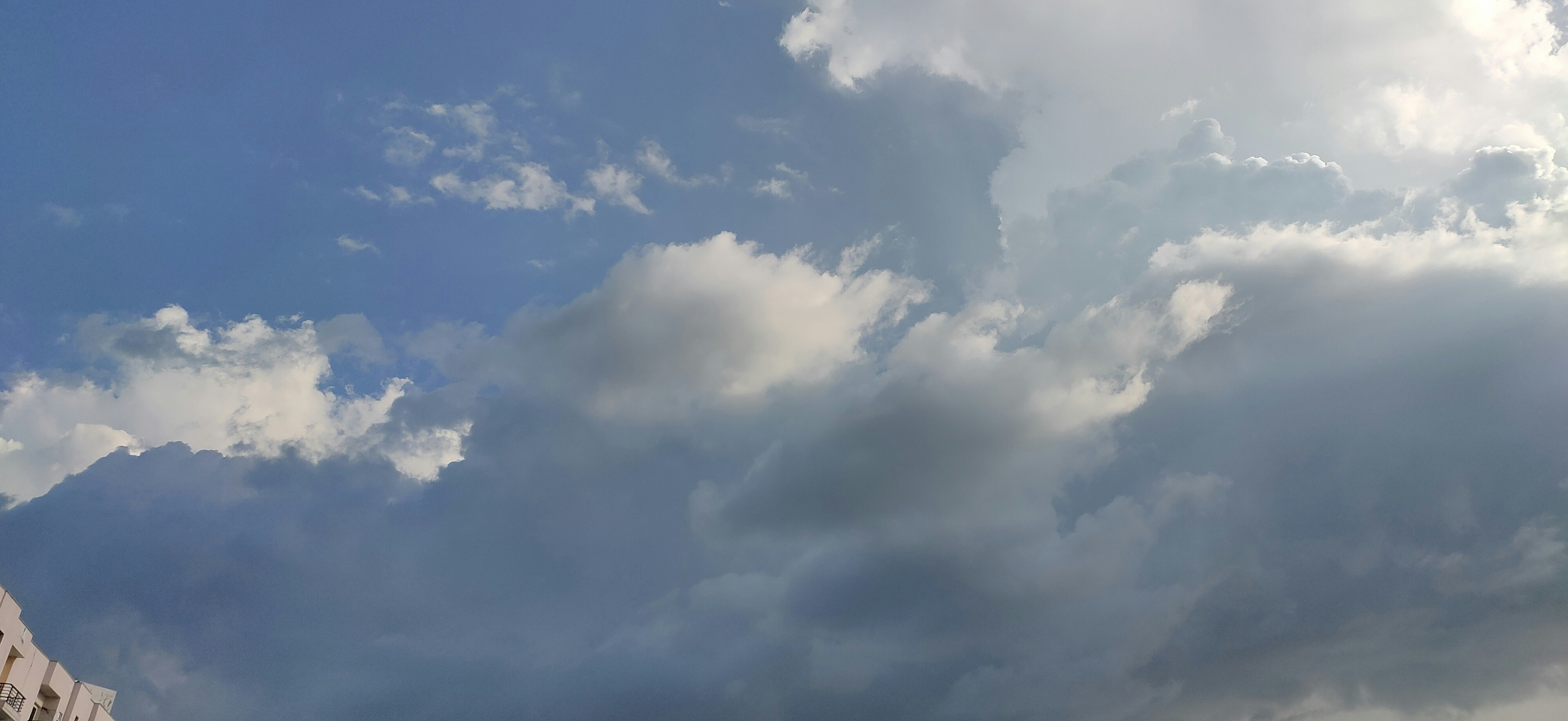 A very tall building under a cloudy blue sky photo – Free Lucknow Image ...