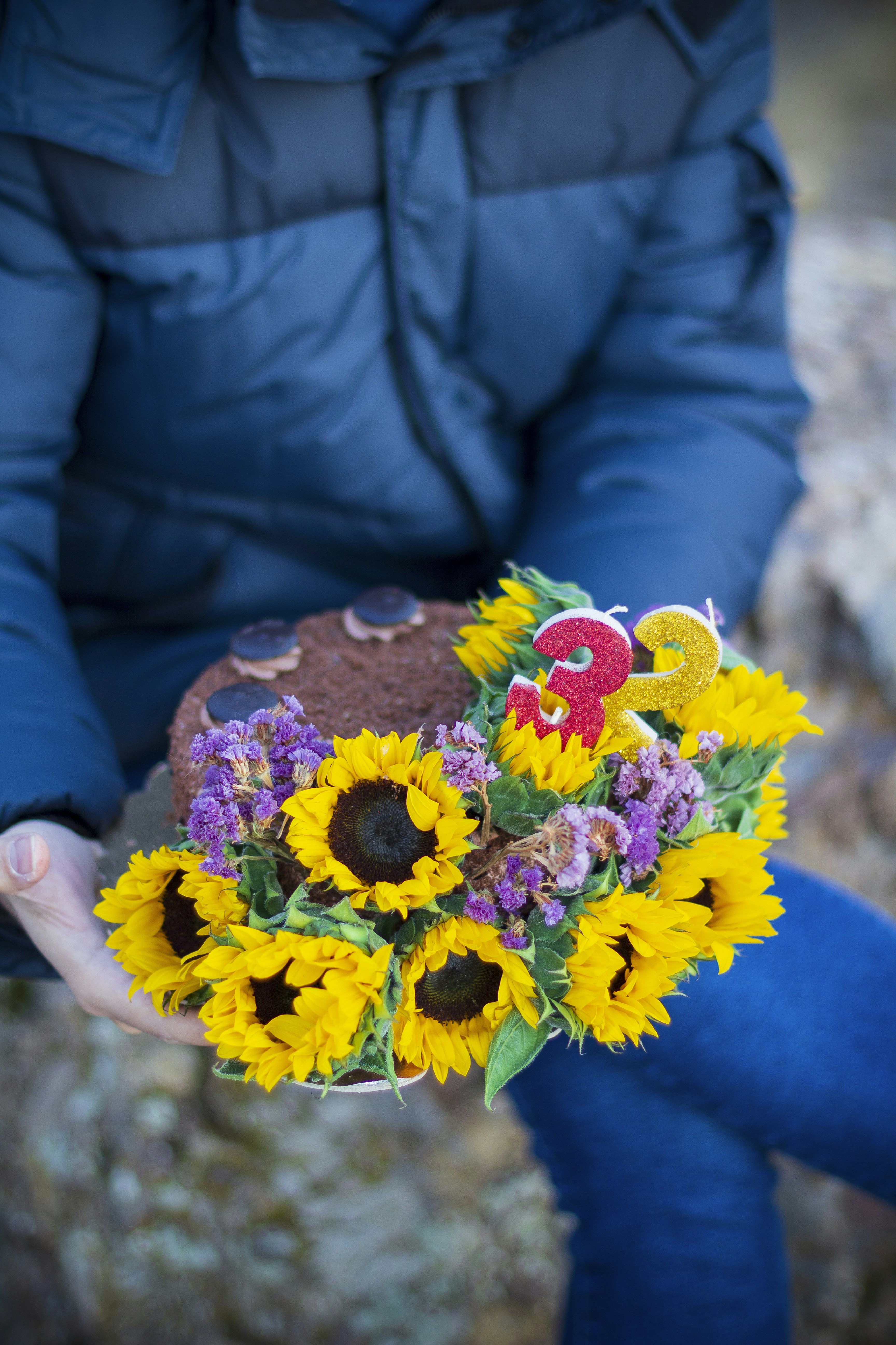Sunflower Bouquet and 32 Candles: A Simple Birthday Moment in a Blue Jacket