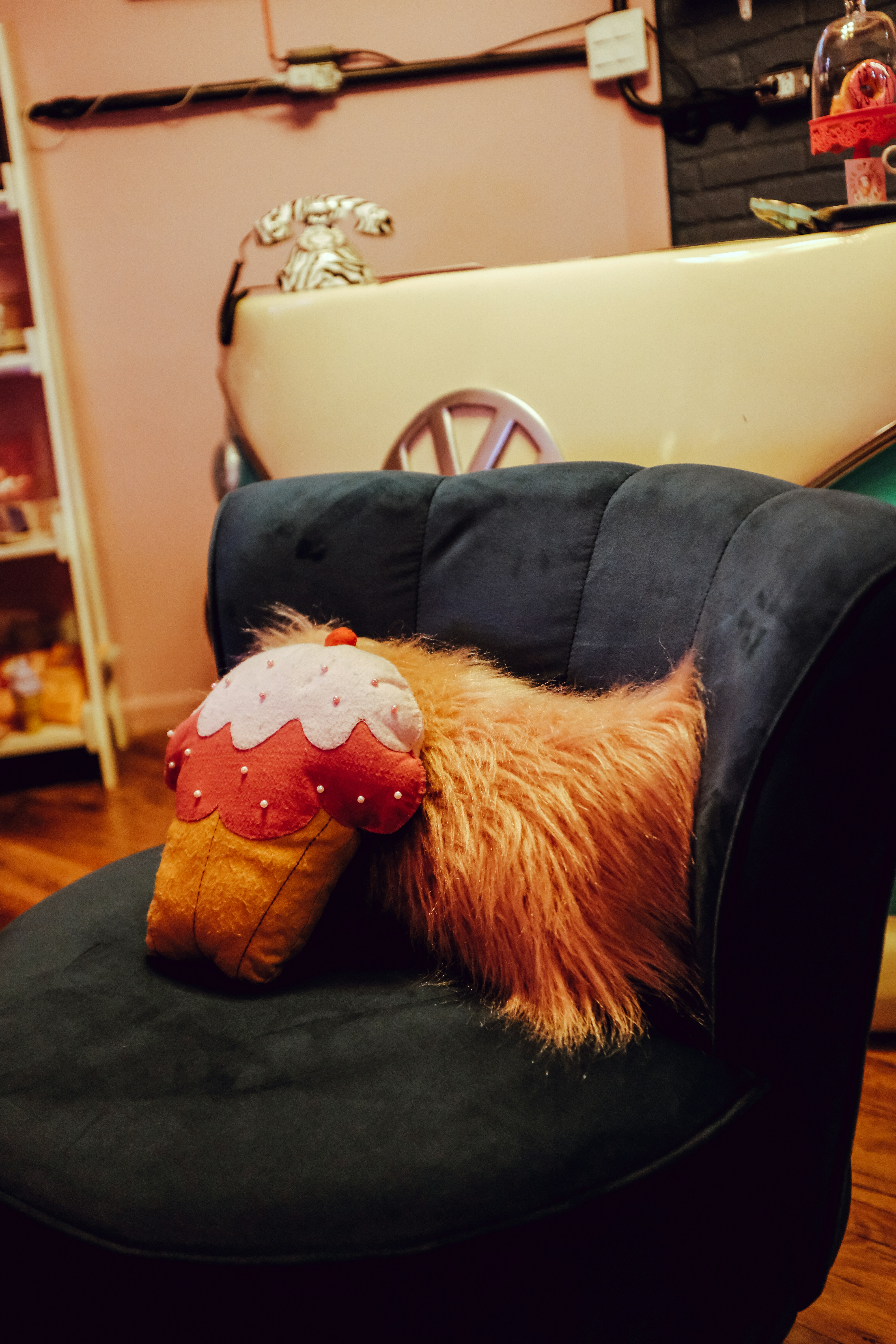 Ice-Cream Plush on Velvet Chair in a Warm, Quirky Studio Corner