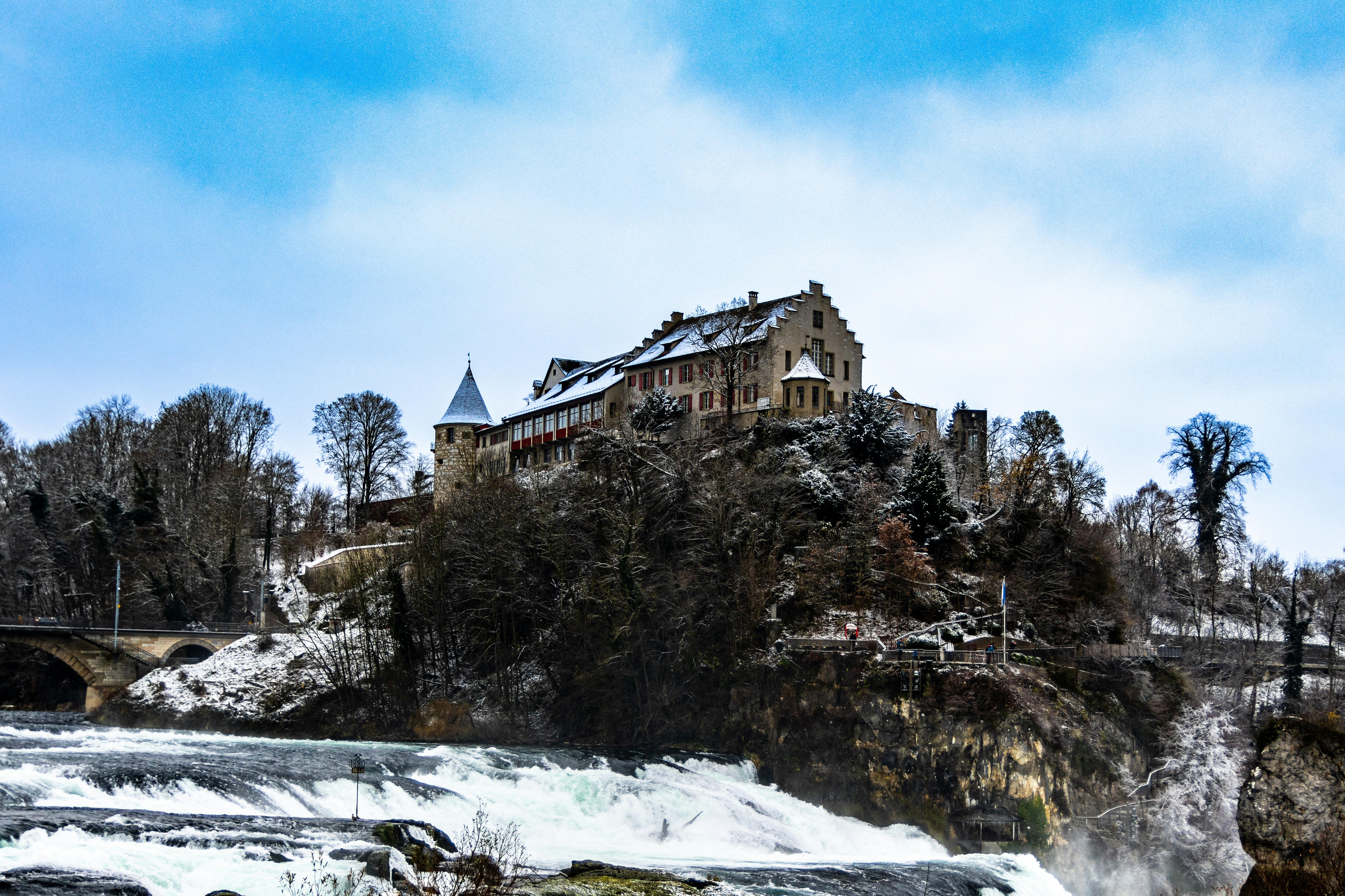 A castle on top of a mountain with a waterfall photo – Free Forest ...