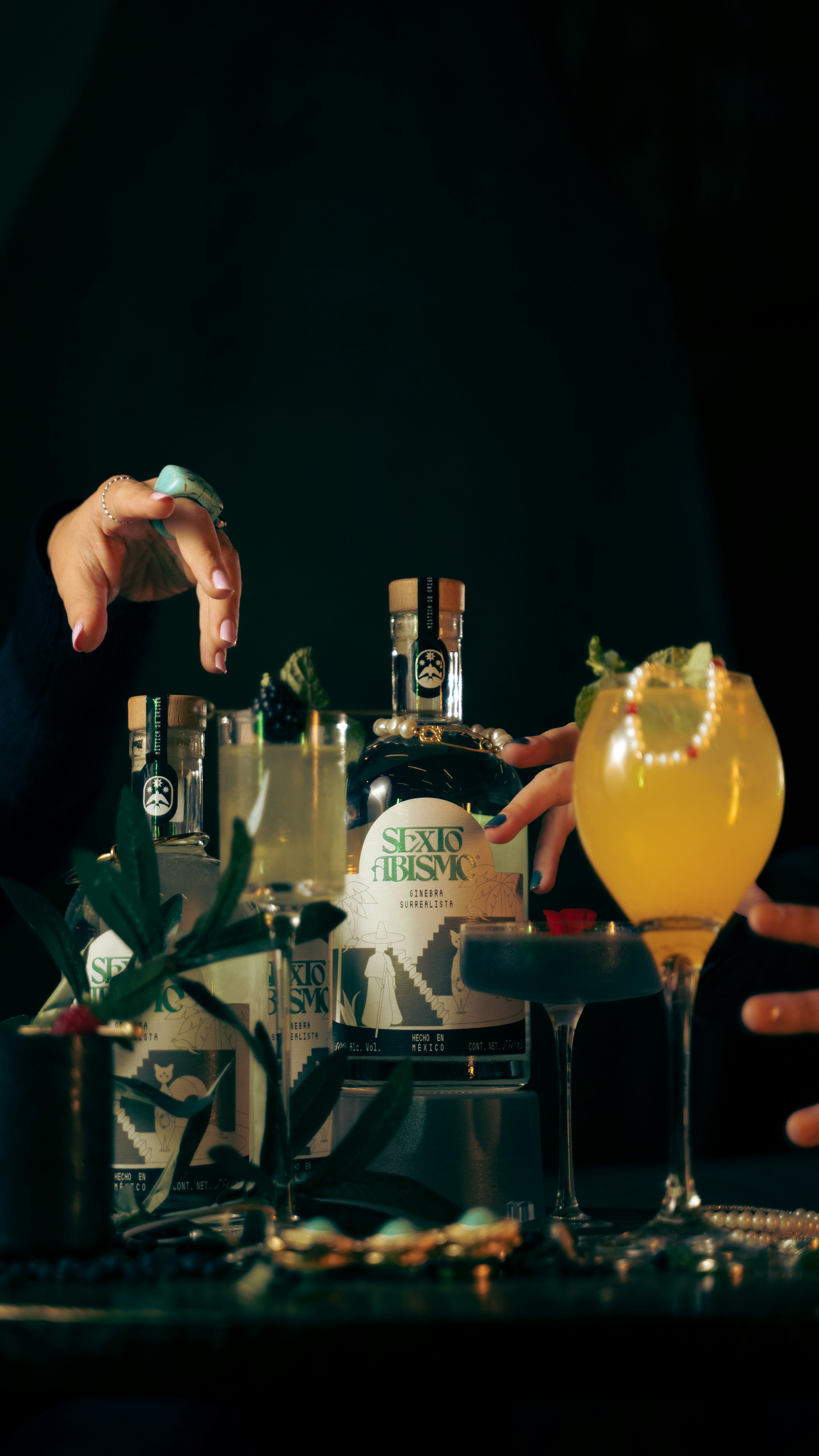 A person holding a cocktail in front of a bar photo – Free Bartender ...
