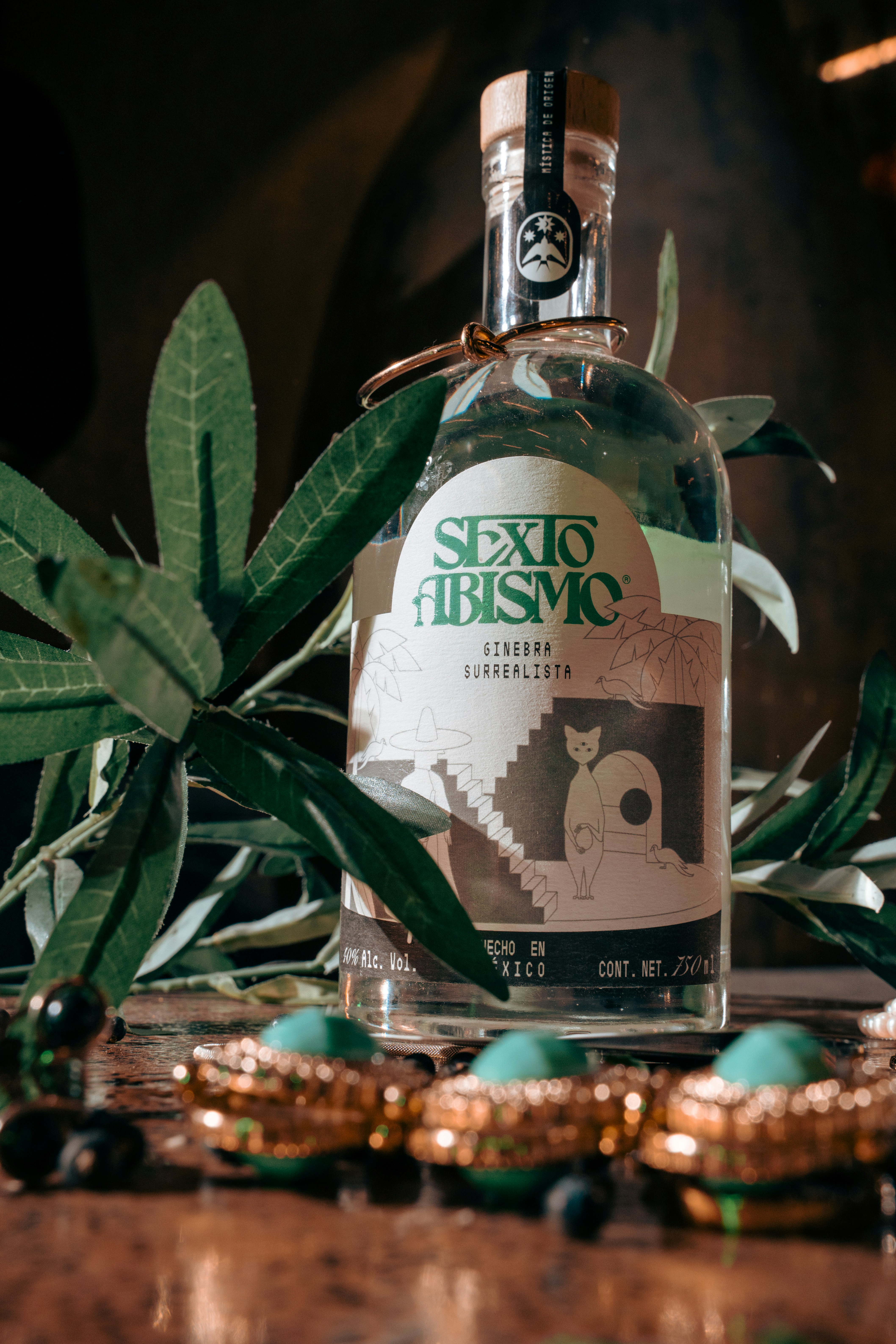 Olive Fronds Frame a Glass Bottle with an Illustrated Label