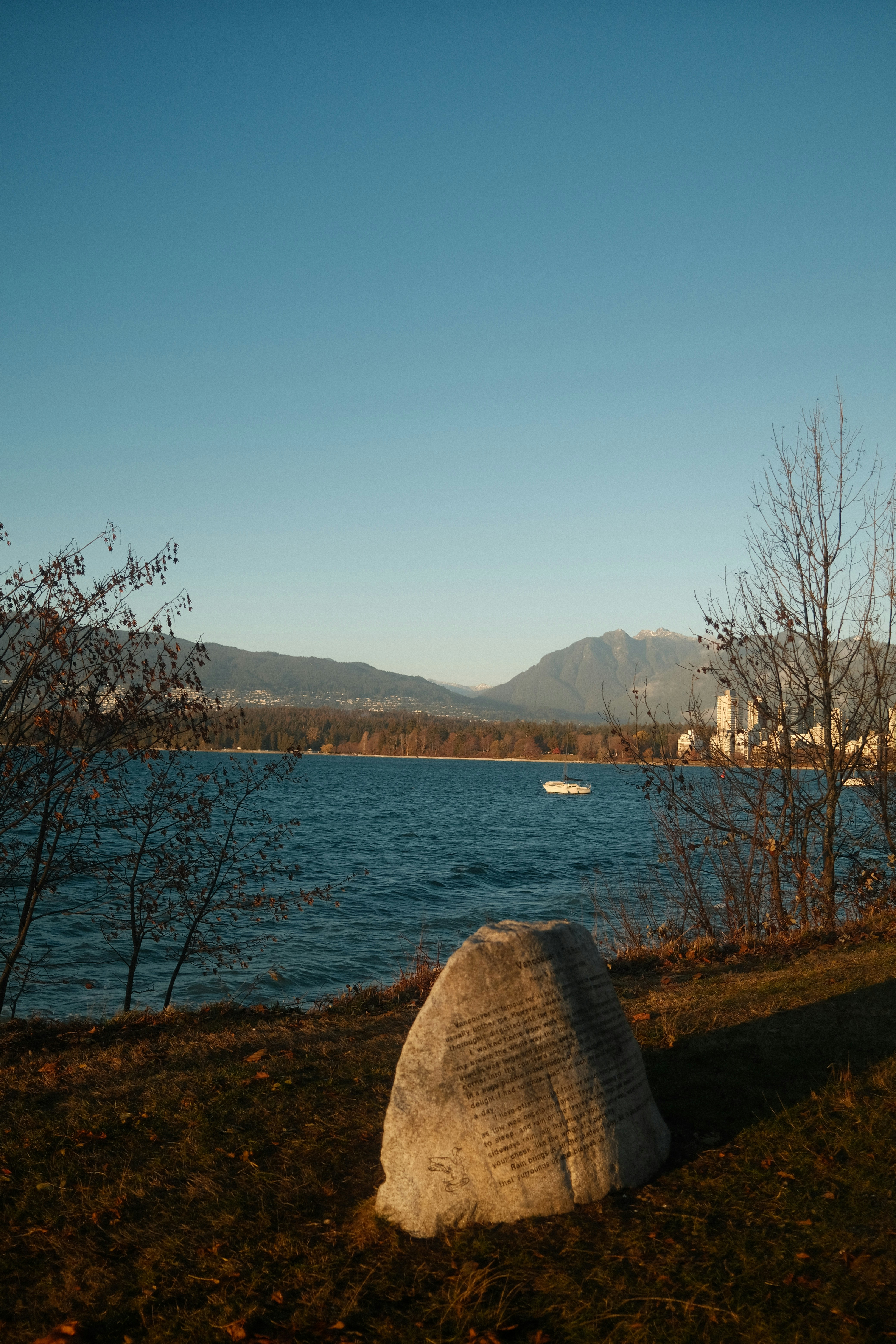 Ridge and Rowboat by the Lake at Dusk
